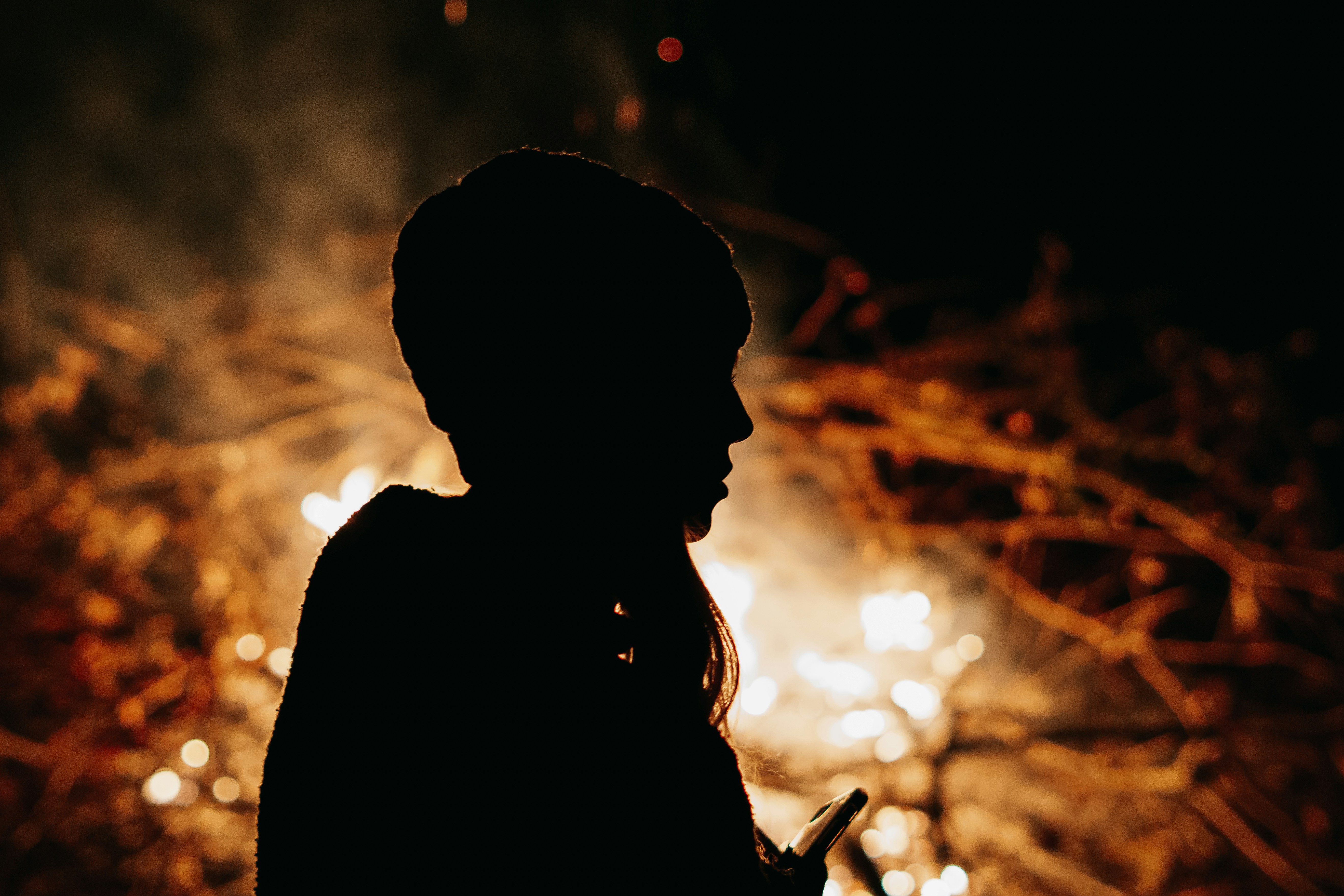 Ember-Glow Silhouette: A Figure Amidst the Fire
