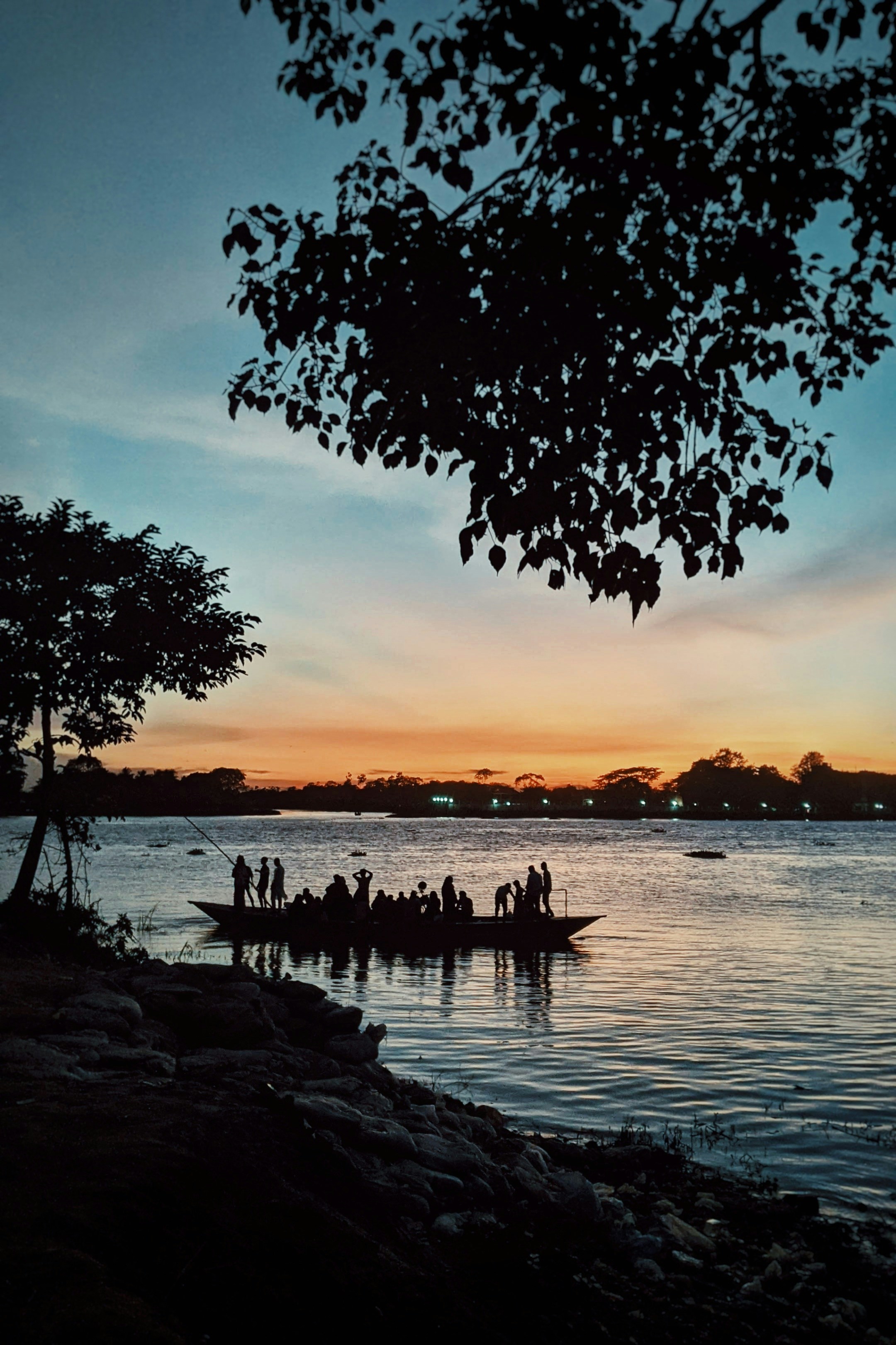 a group of people on a boat in the water