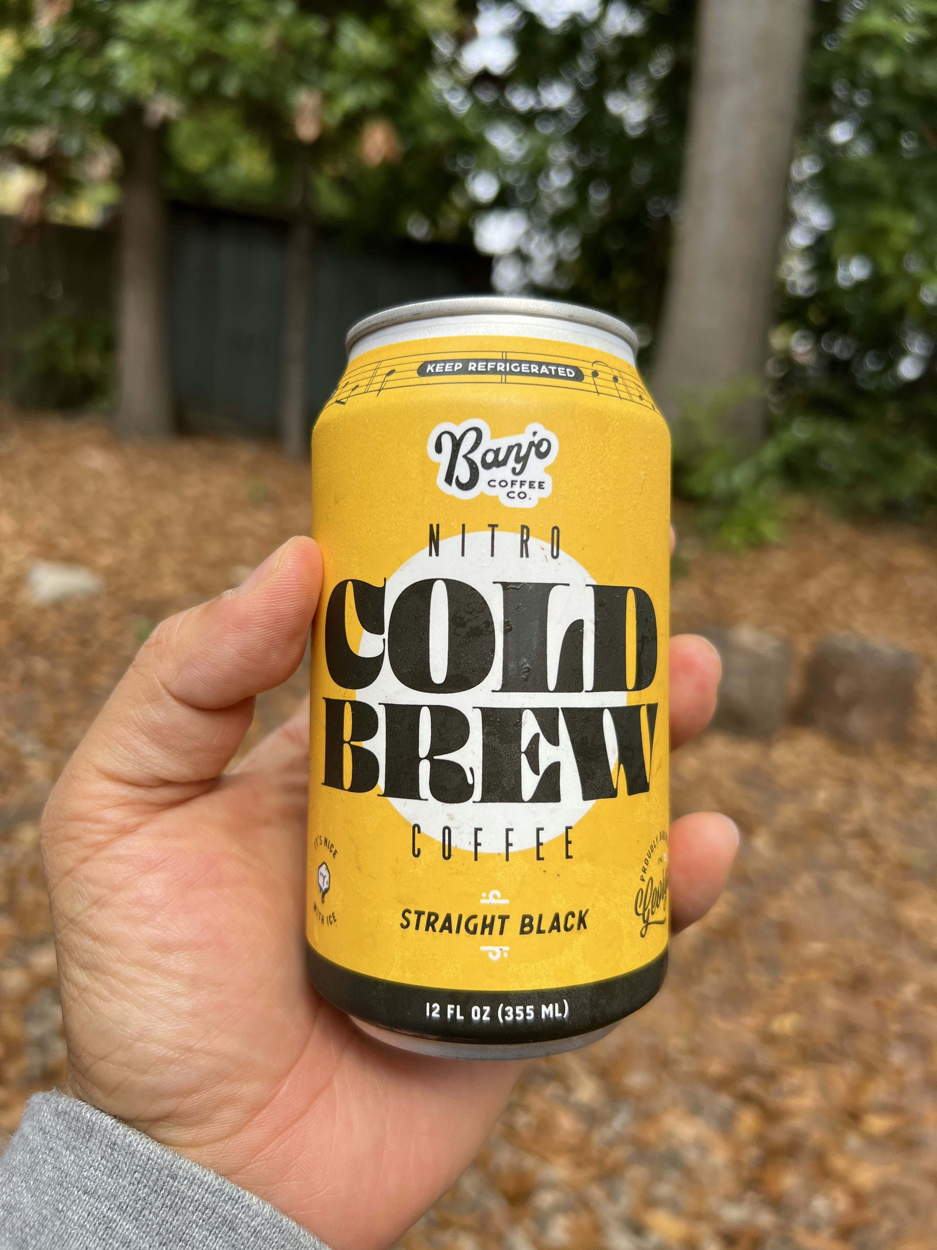 a hand holding a can of food