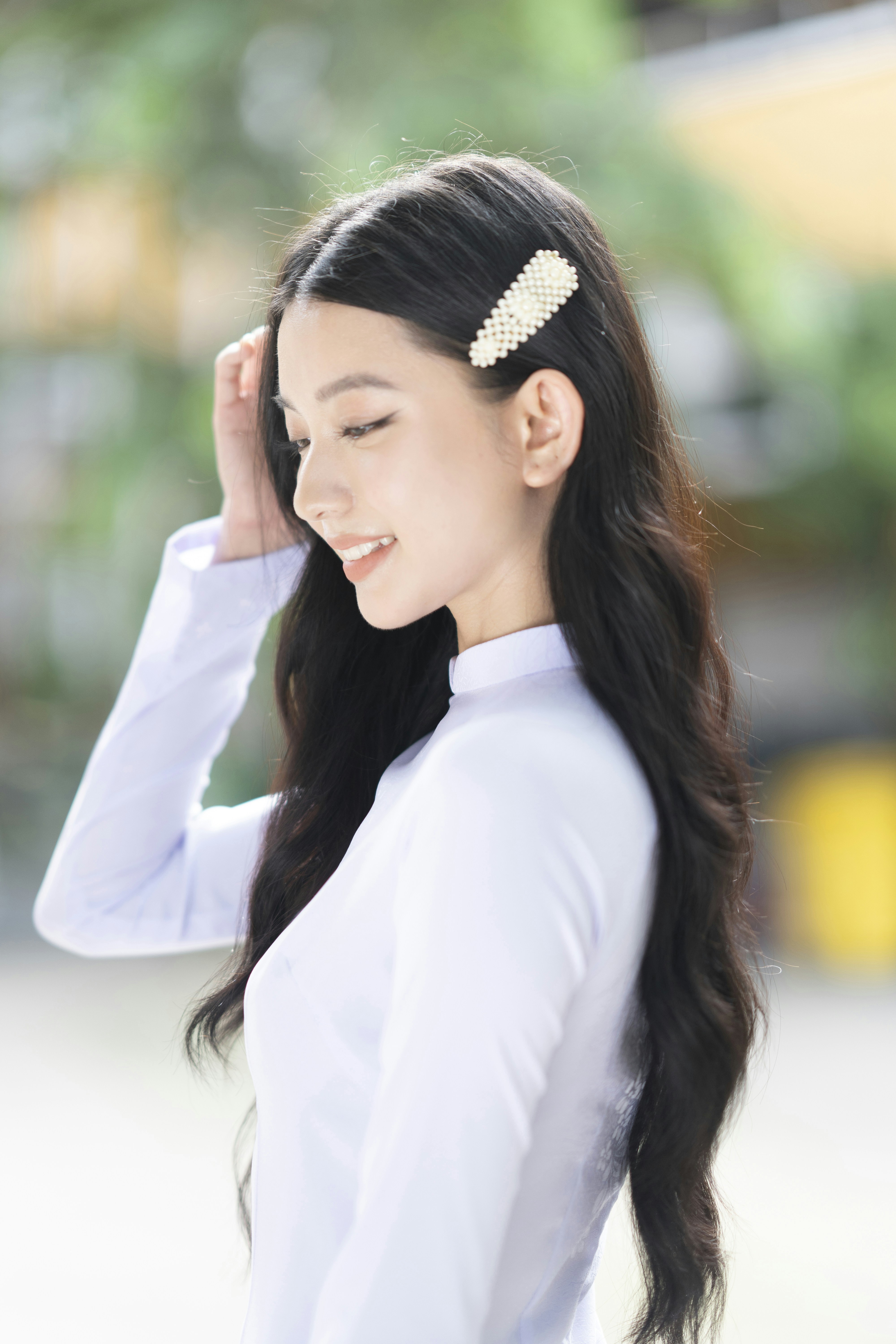 Pearl-clasped Portrait: A serene profile in soft light