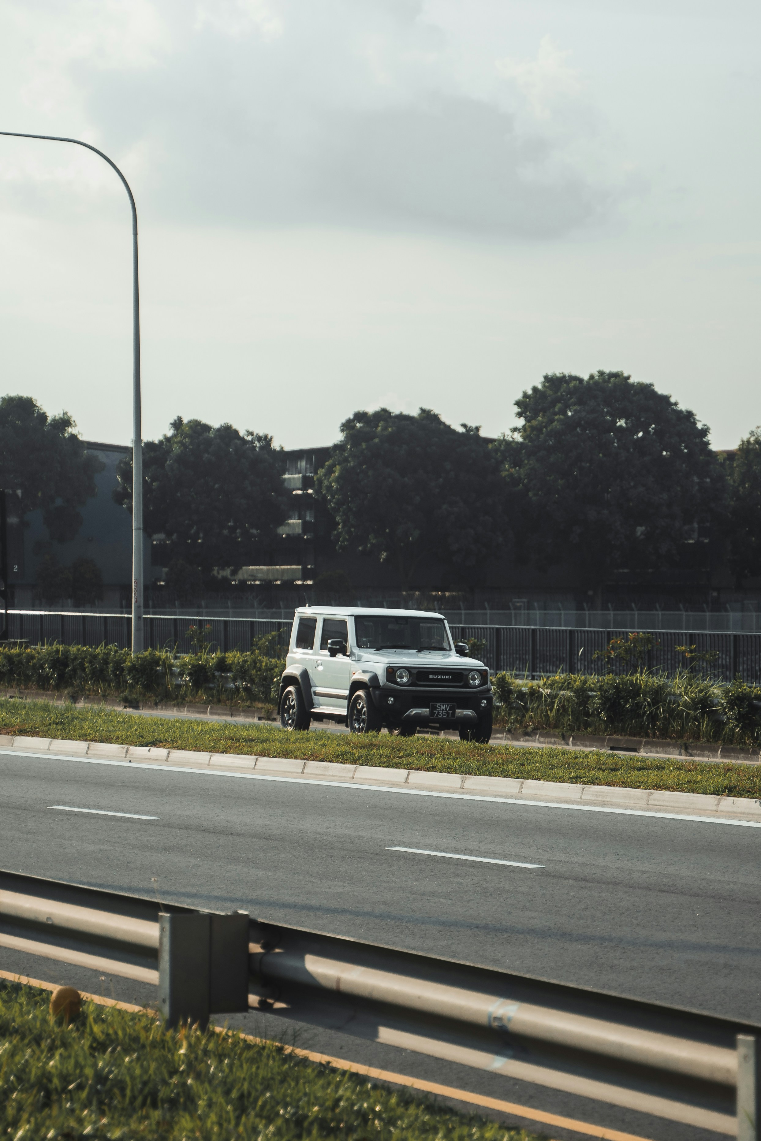 City Highway Patrol: A Mineral White SUV on a Quiet Road