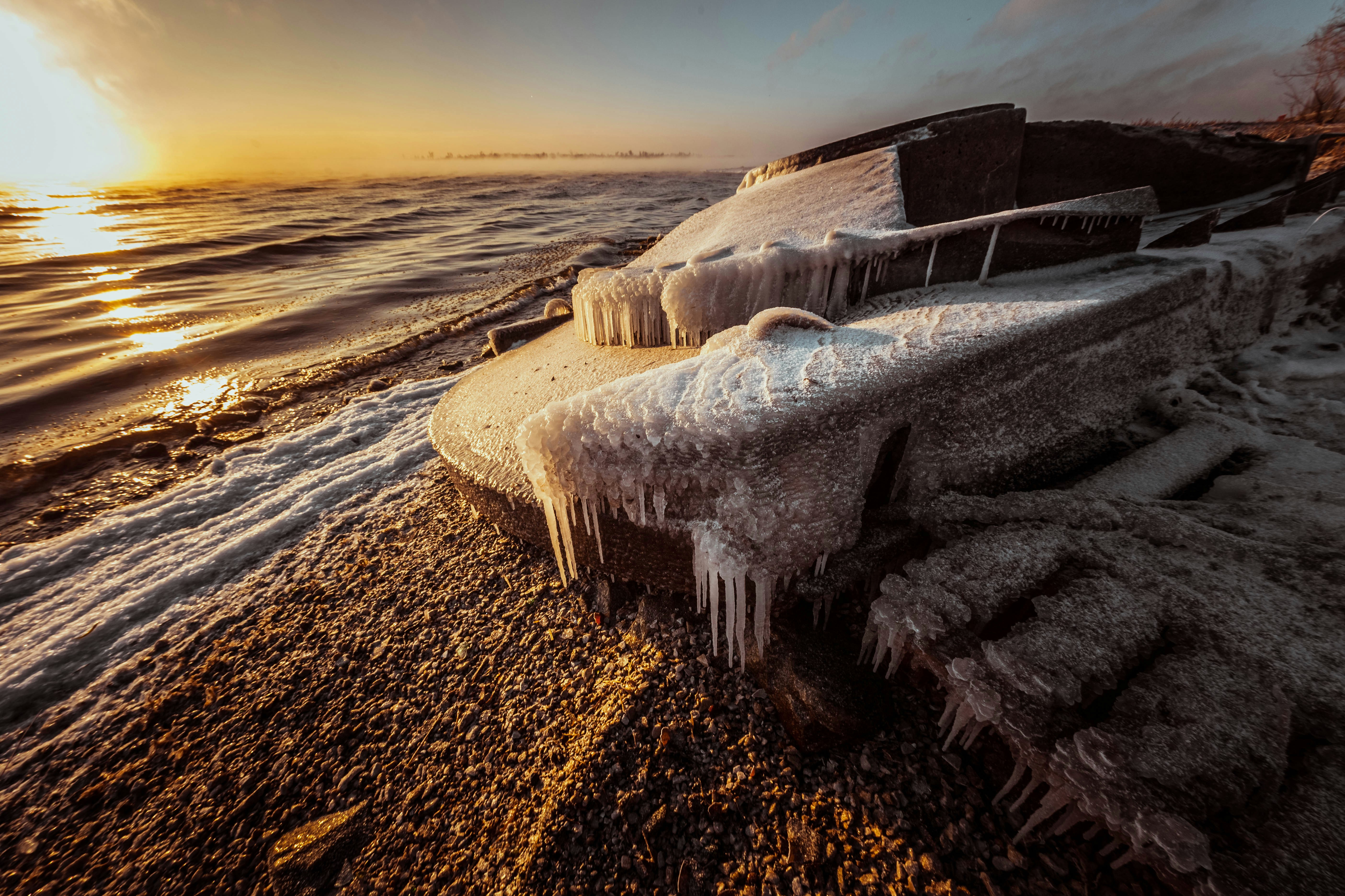 Frozen Piers at Sunset: Ice-Glazed Steps Meet the Quiet Shore