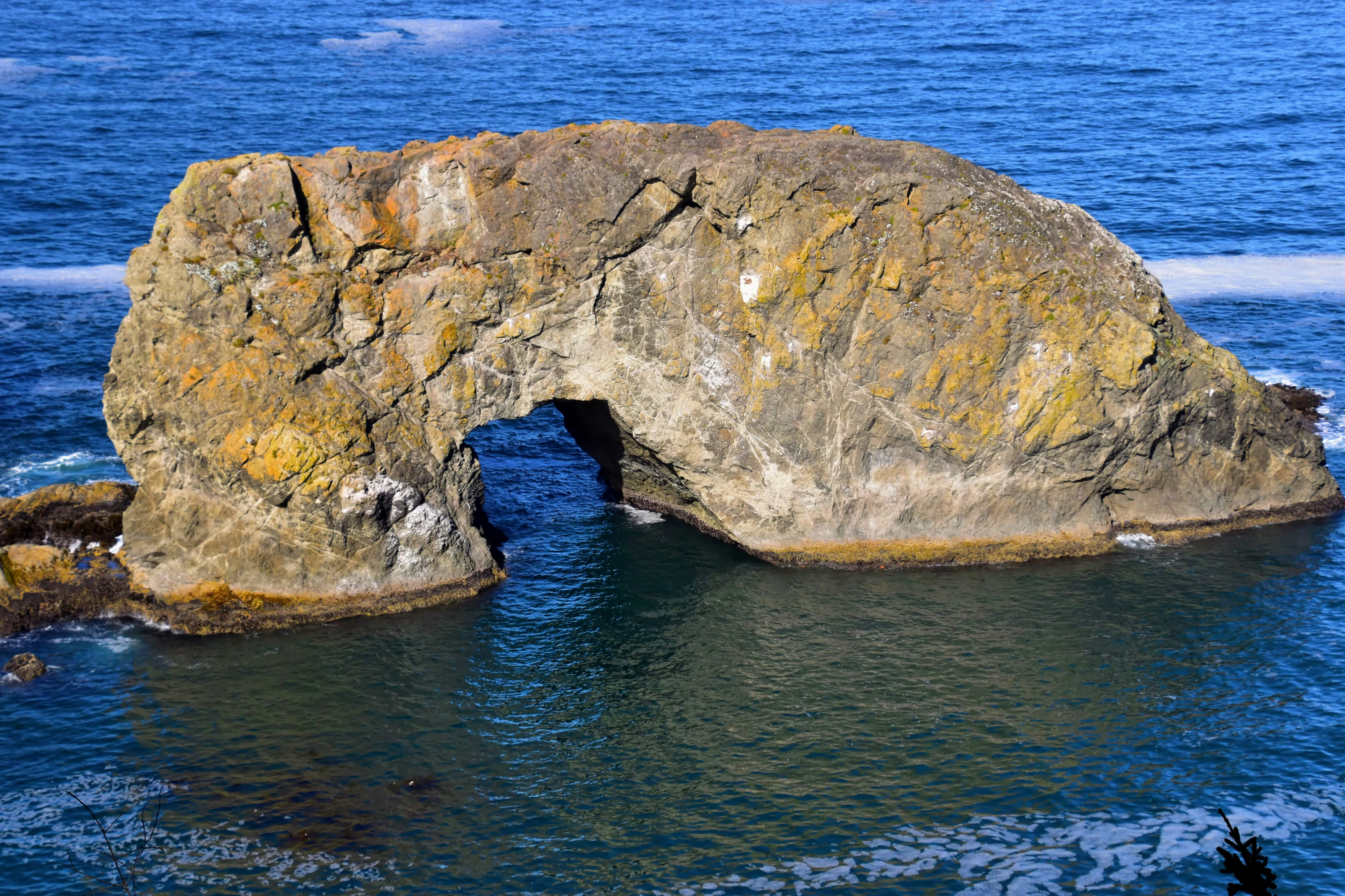 a large rock in the water