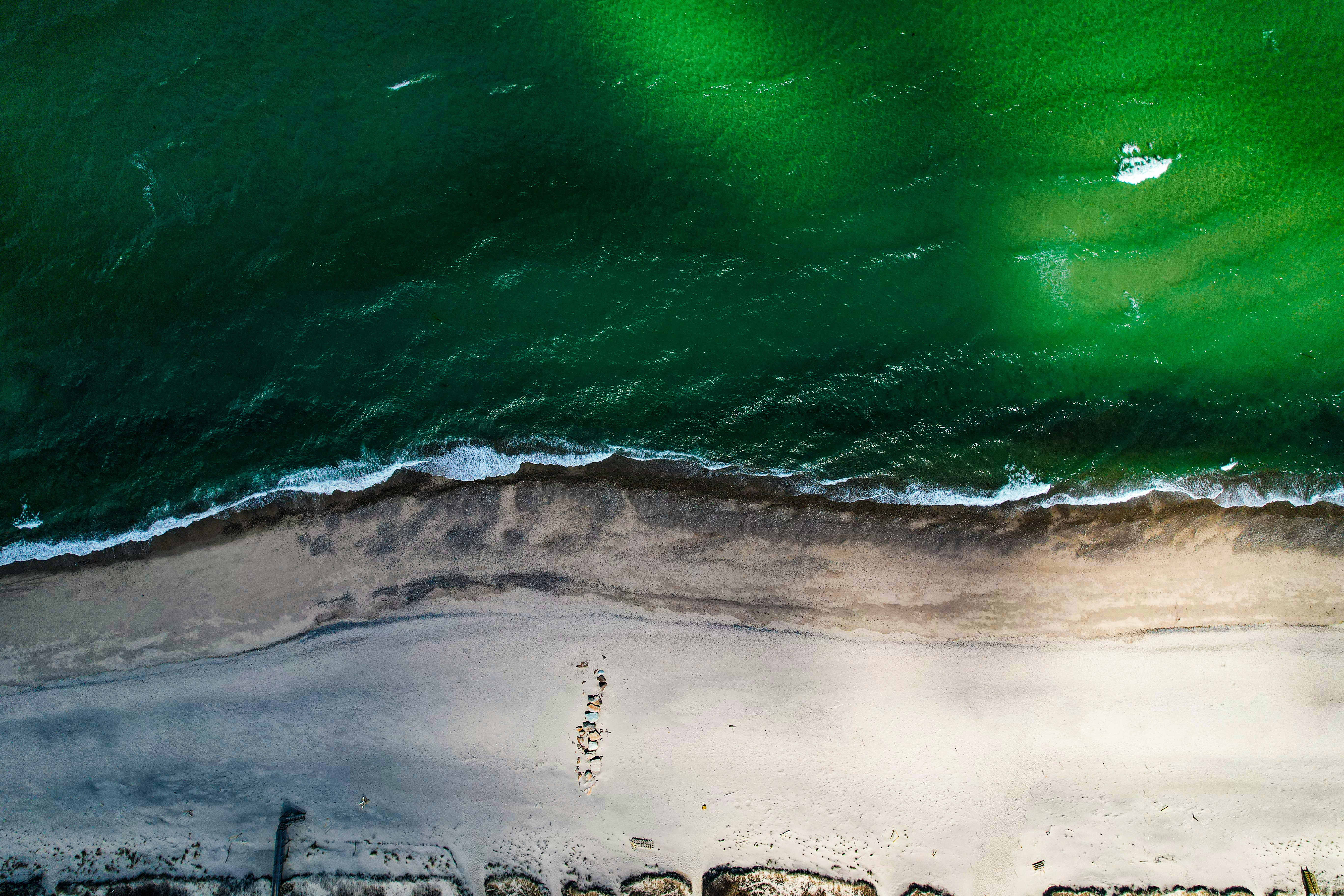 Coastline Bisected: Aerial Dance of Seafoam and Sand