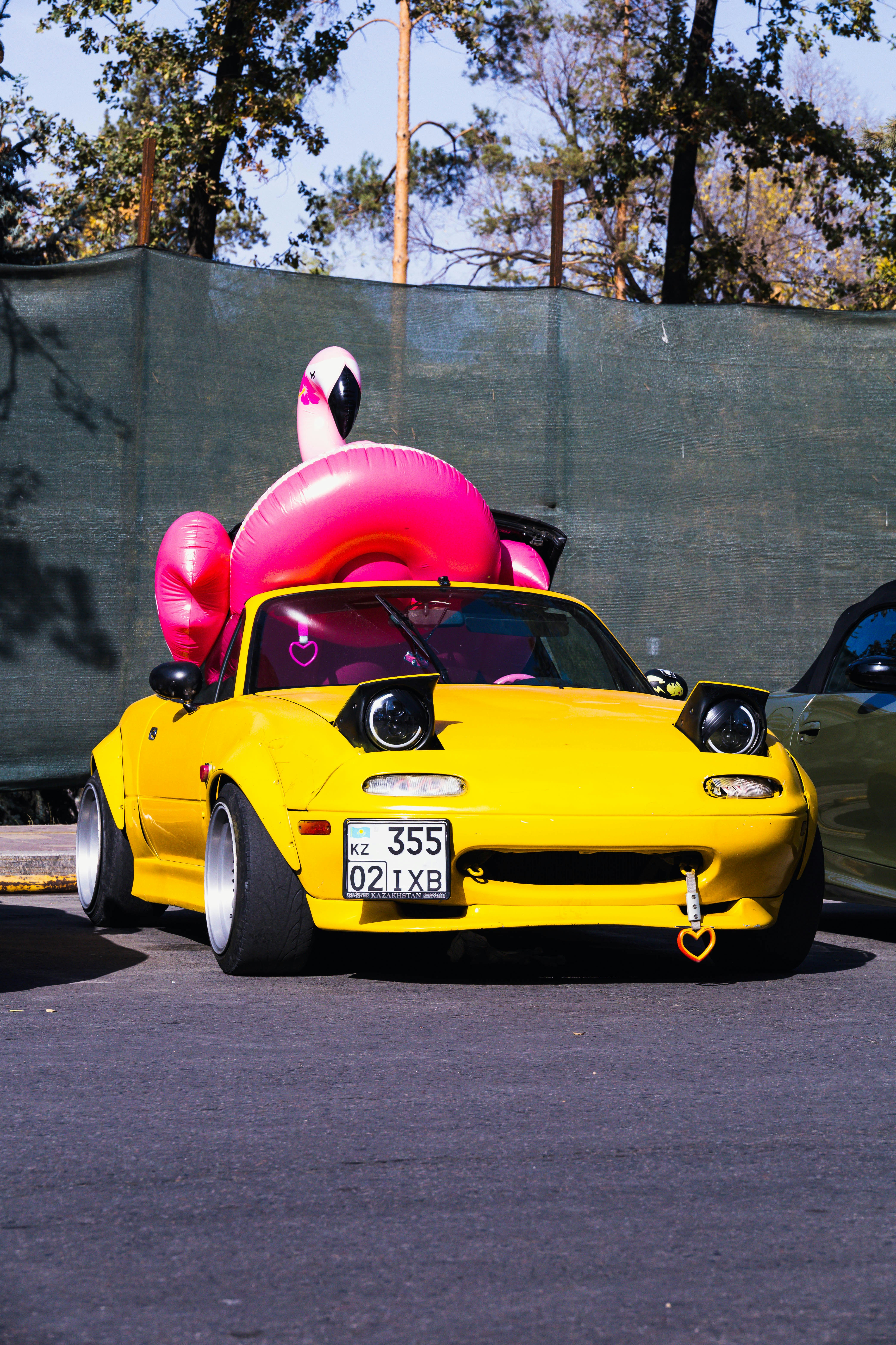 a yellow car with a red hood
