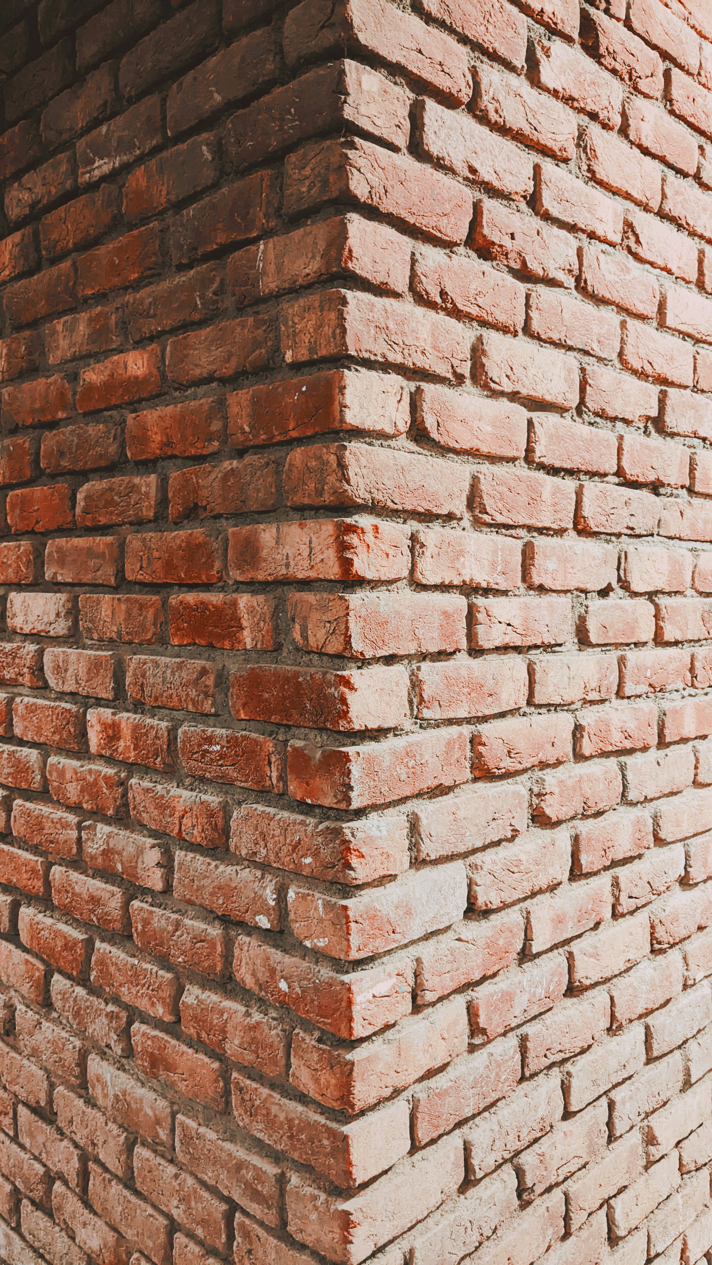 a brick wall with a hole in it