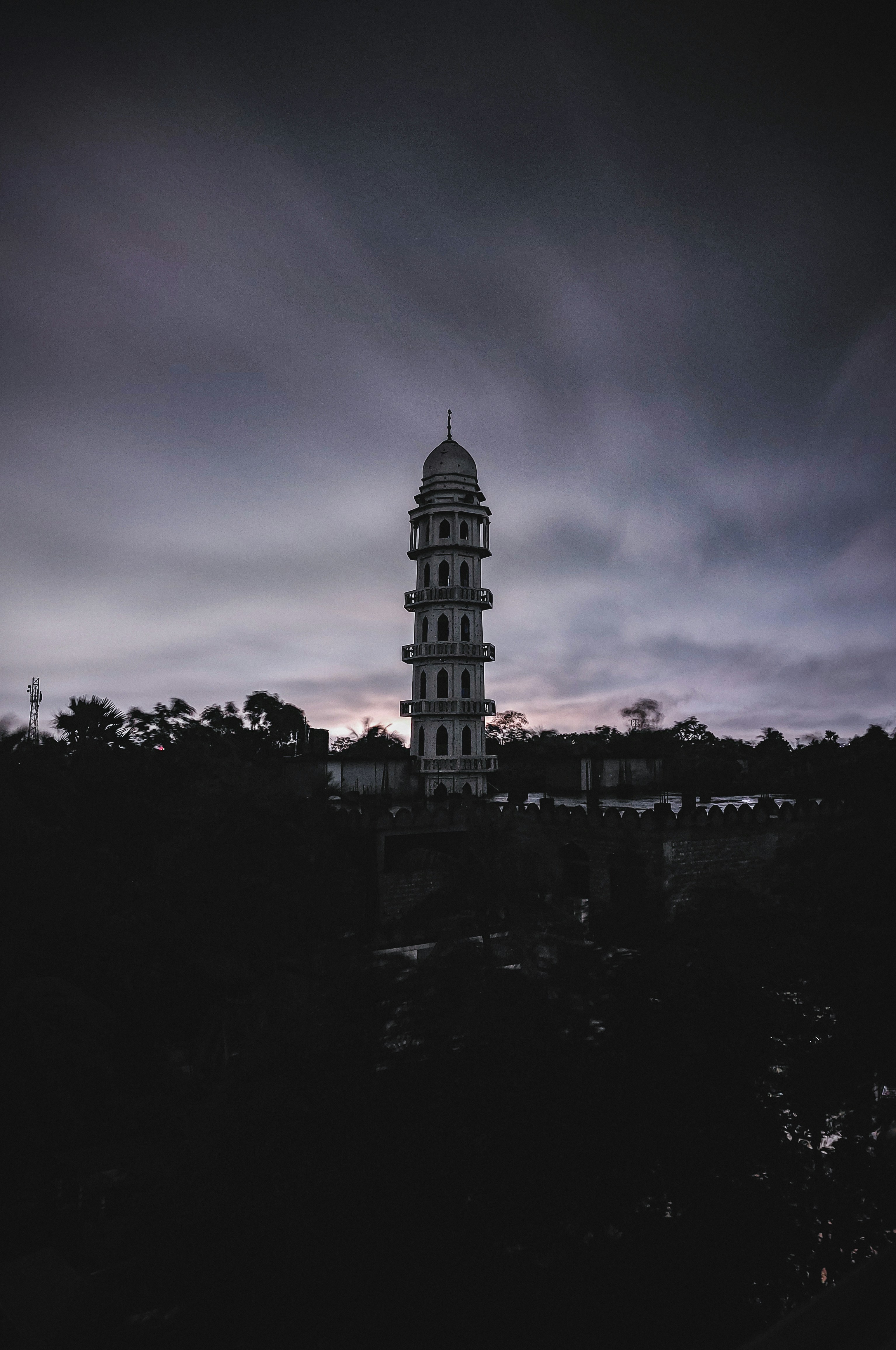 Moonlit Bell Tower Piercing Evening Clouds