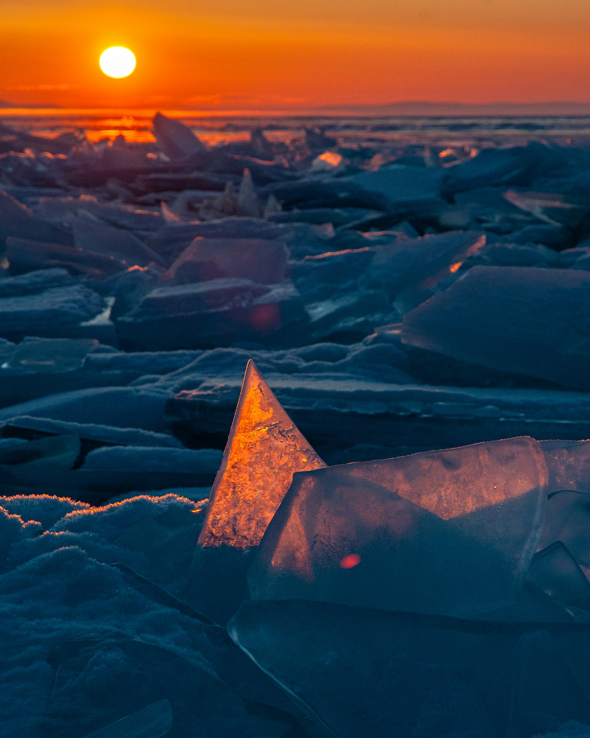 Amber Prism on a Fractured Arctic Sea at Dusk