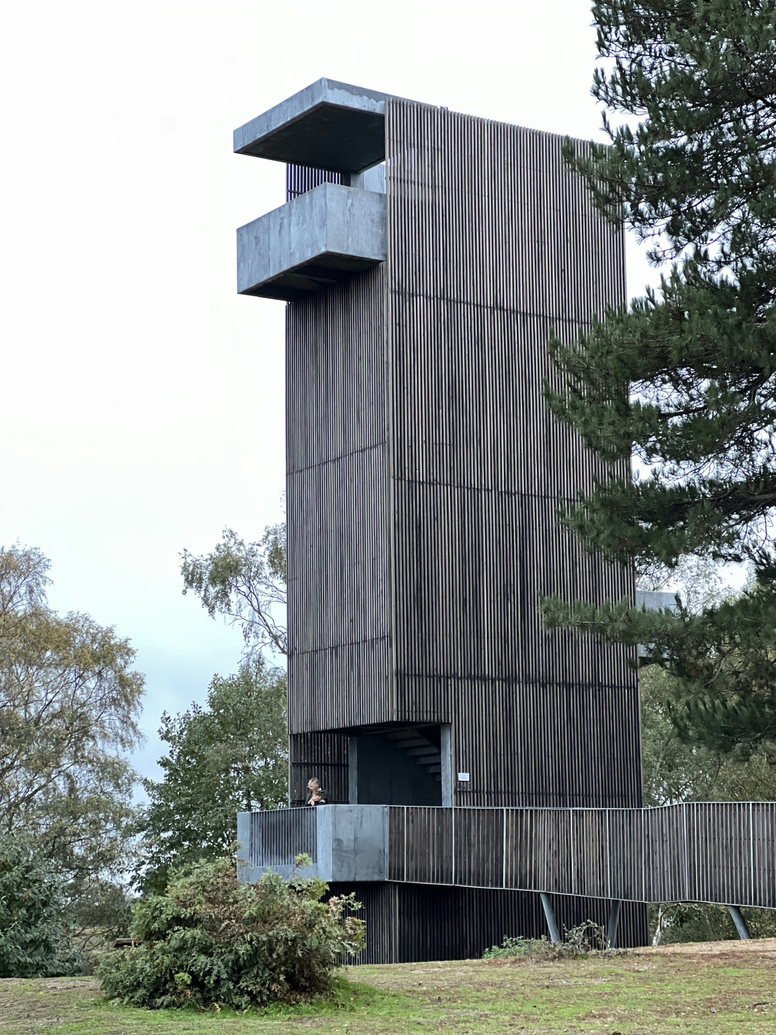a wooden building with a fence around it