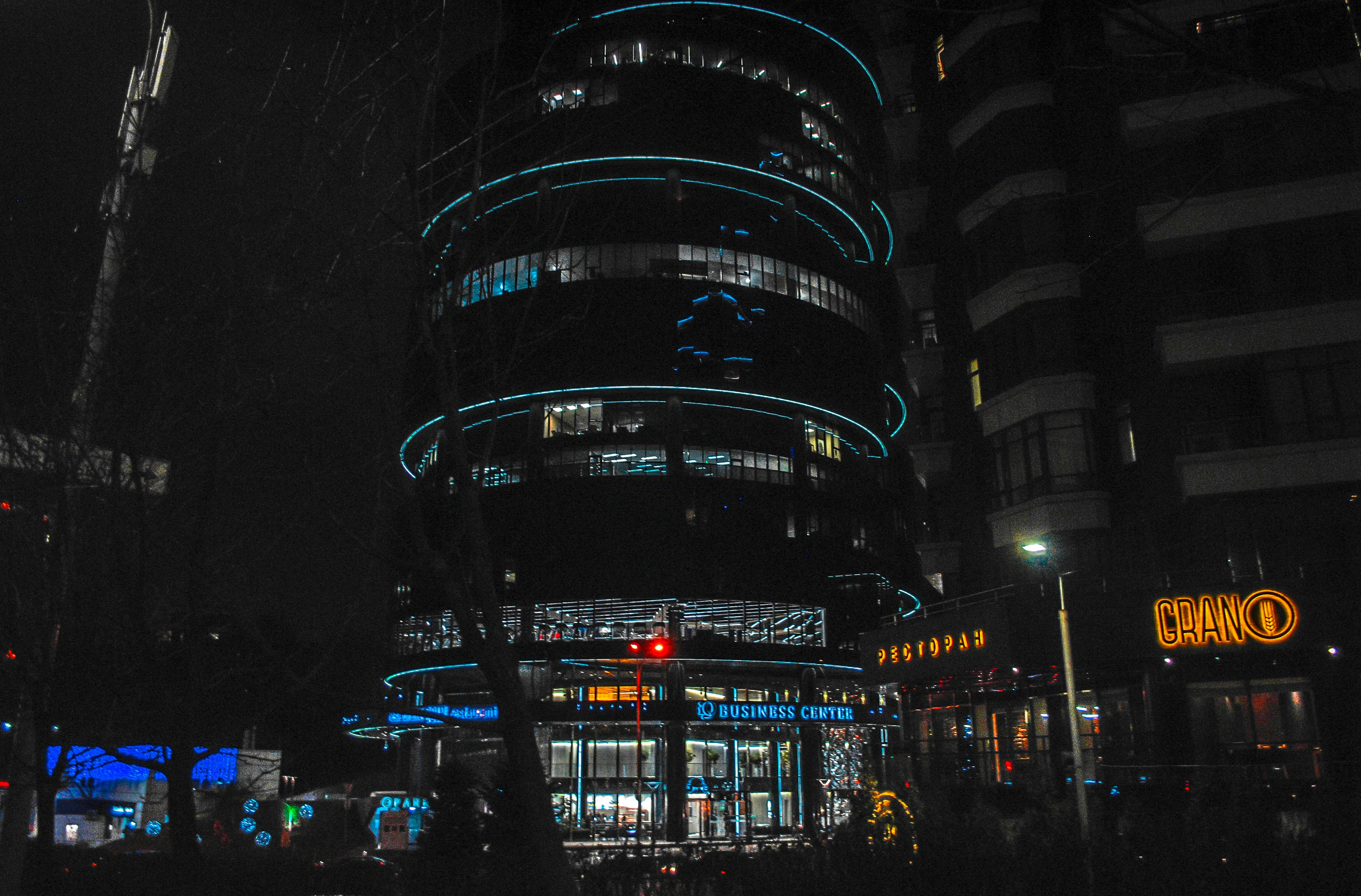 A building with lights at night photo – Free Kyiv Image on Unsplash