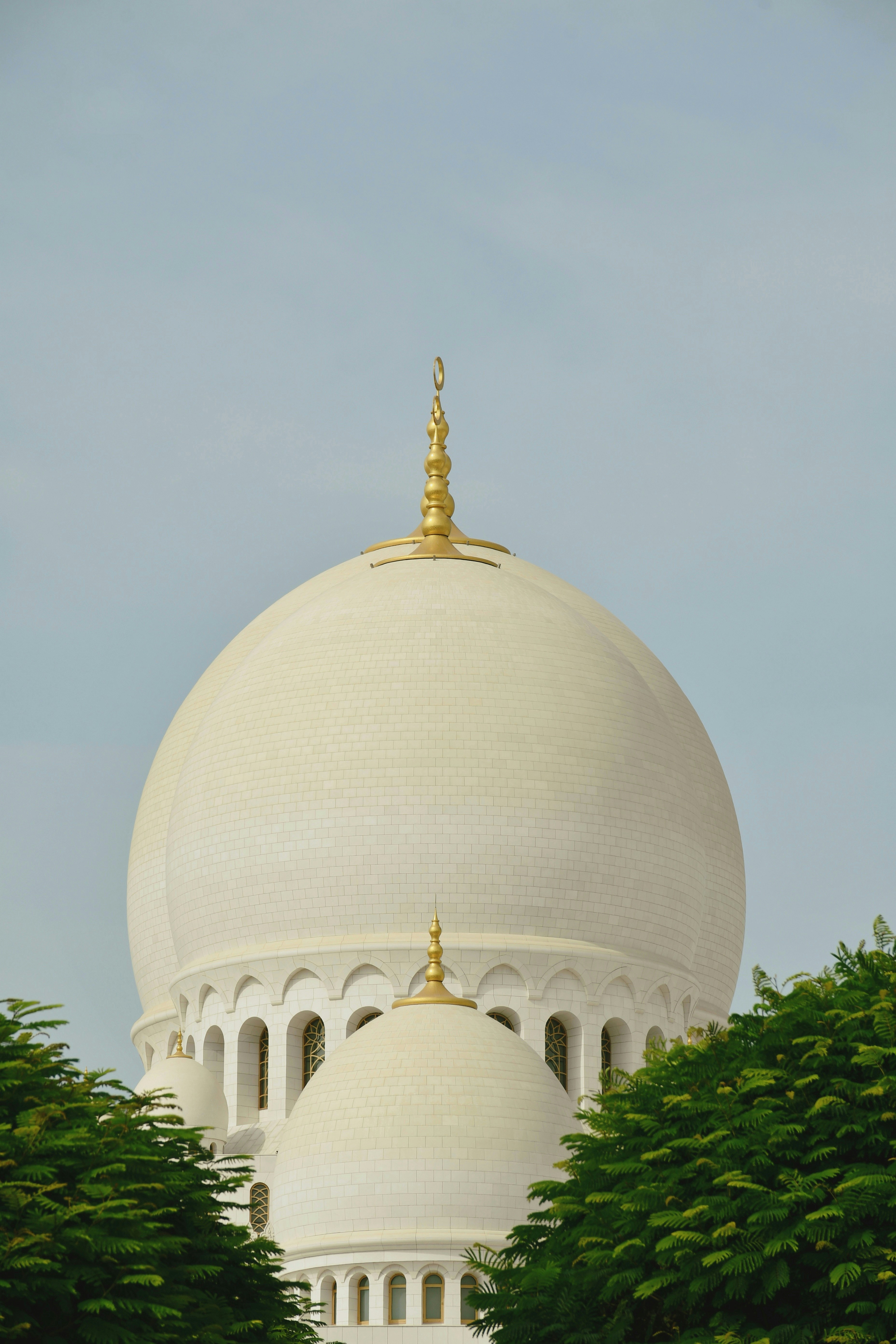 Domed Beacon: A White Mosque Crowned with Golden Finial