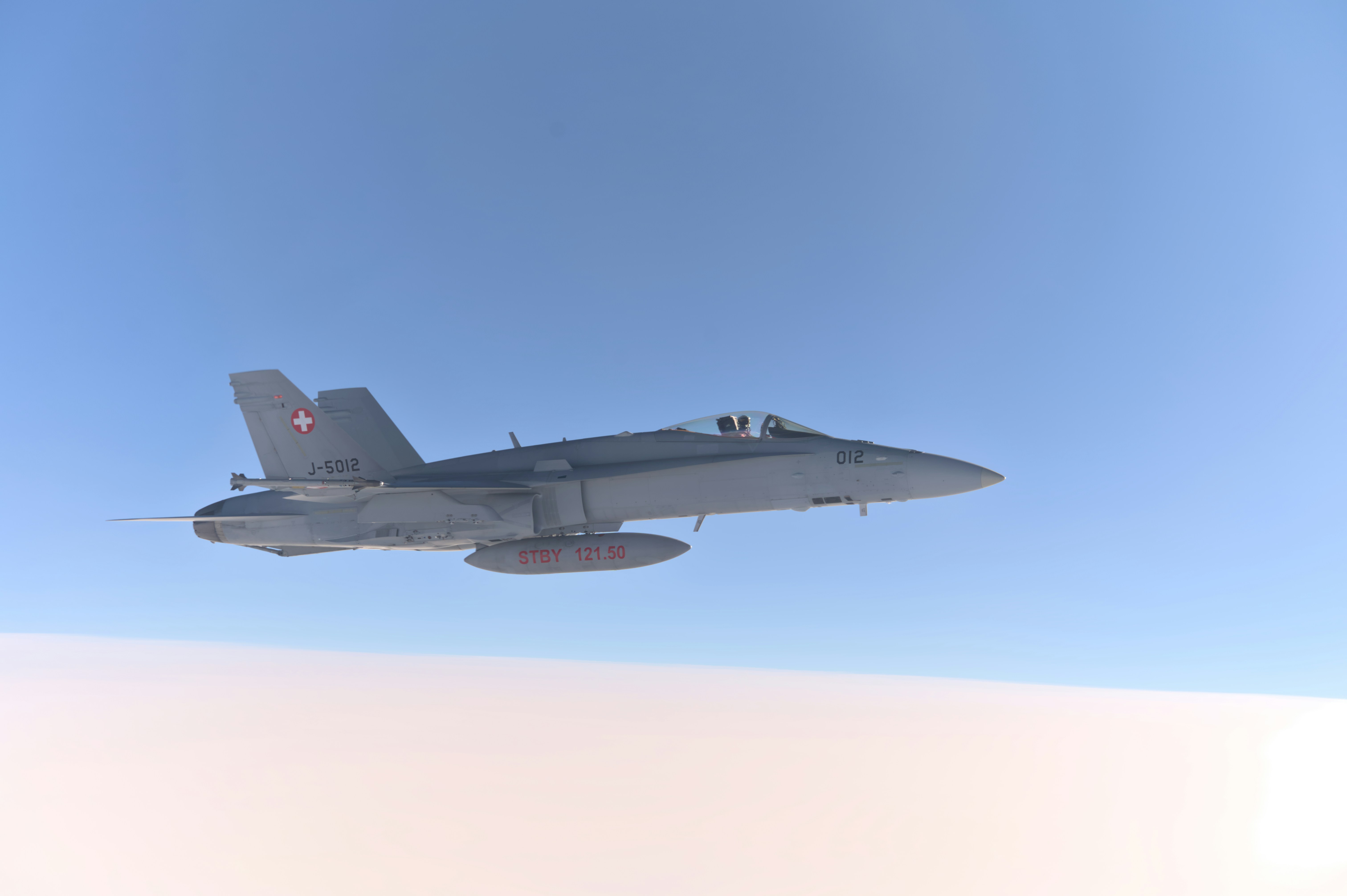 A fighter jet flying in the sky photo – Free Switzerland Image on Unsplash