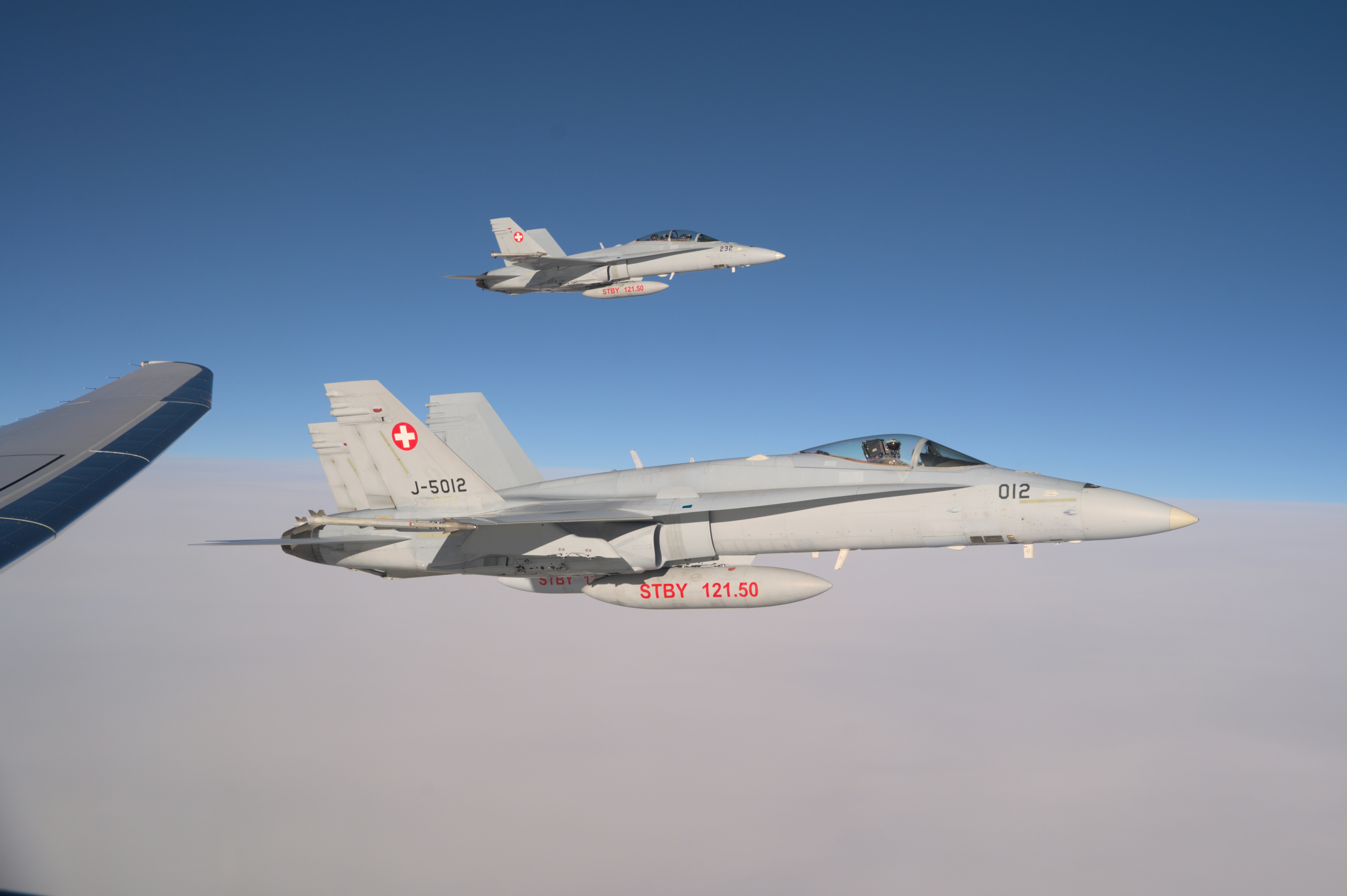 Twin Swiss Jets in Tight Formation Over a Sea of Clouds