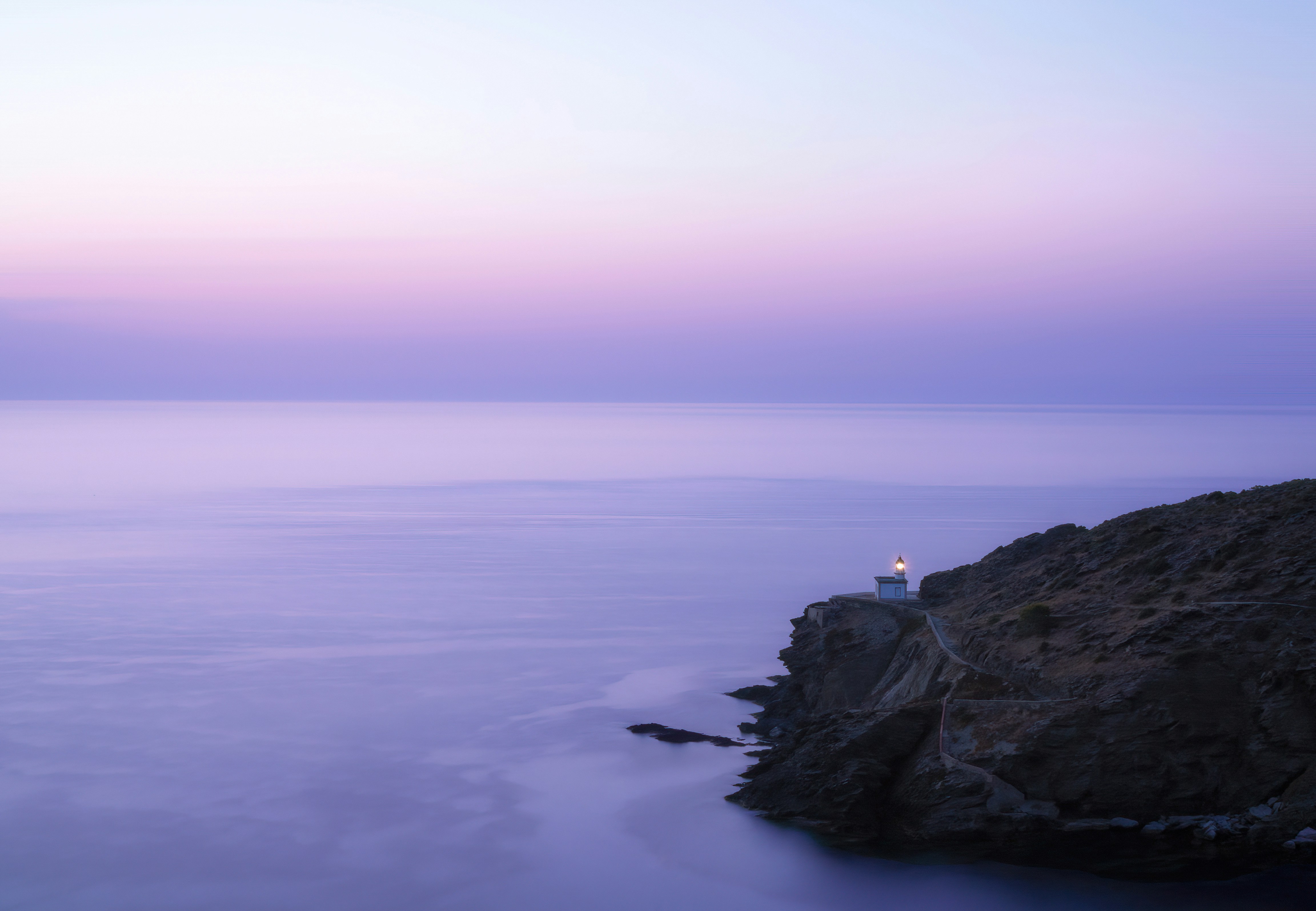 Velvet Dusk at the Cliff: Lighthouse Over a Quiet Sea