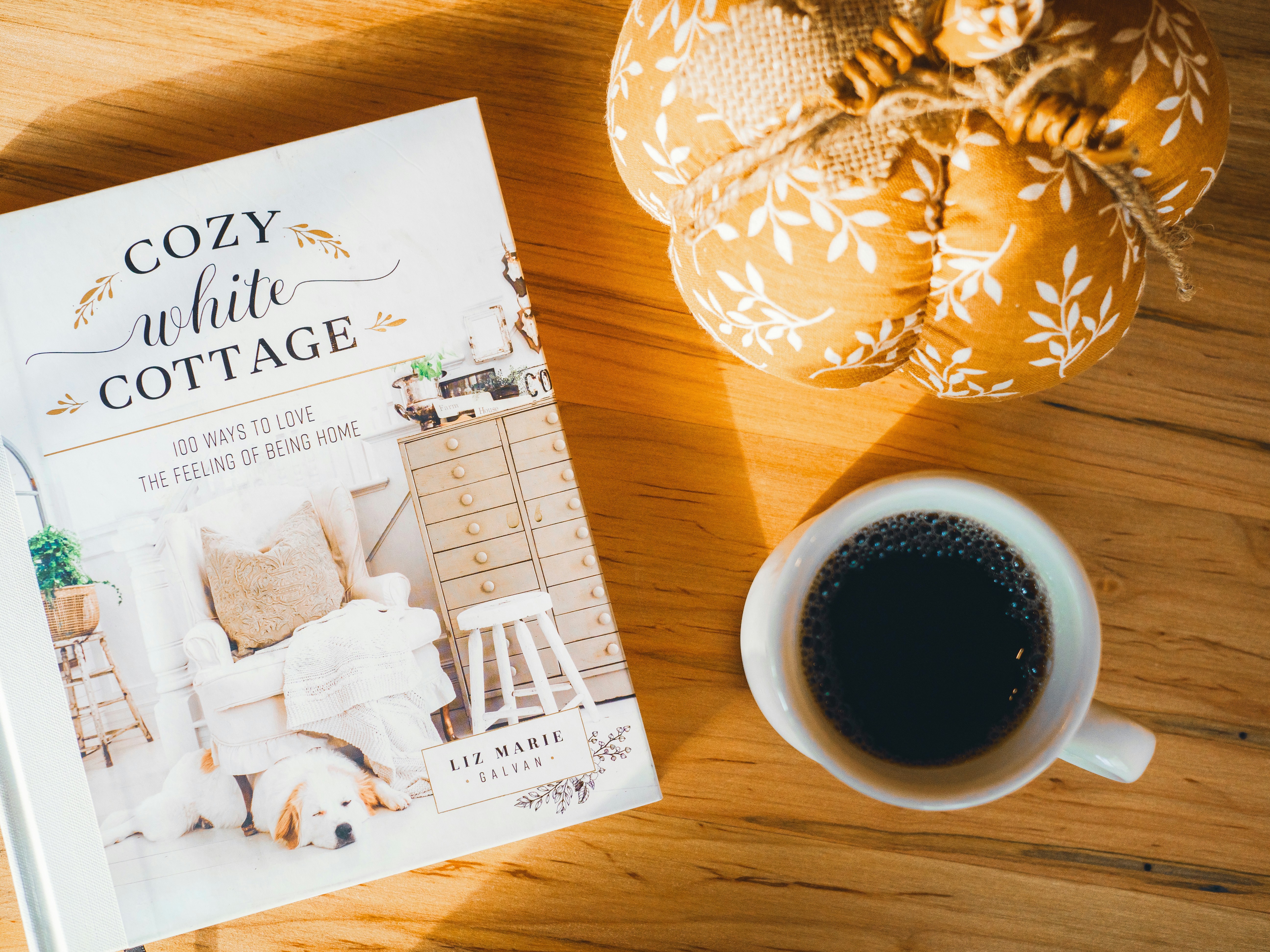 Sunlit Quiet: A Cozy White Cottage Moment on a Rustic Table