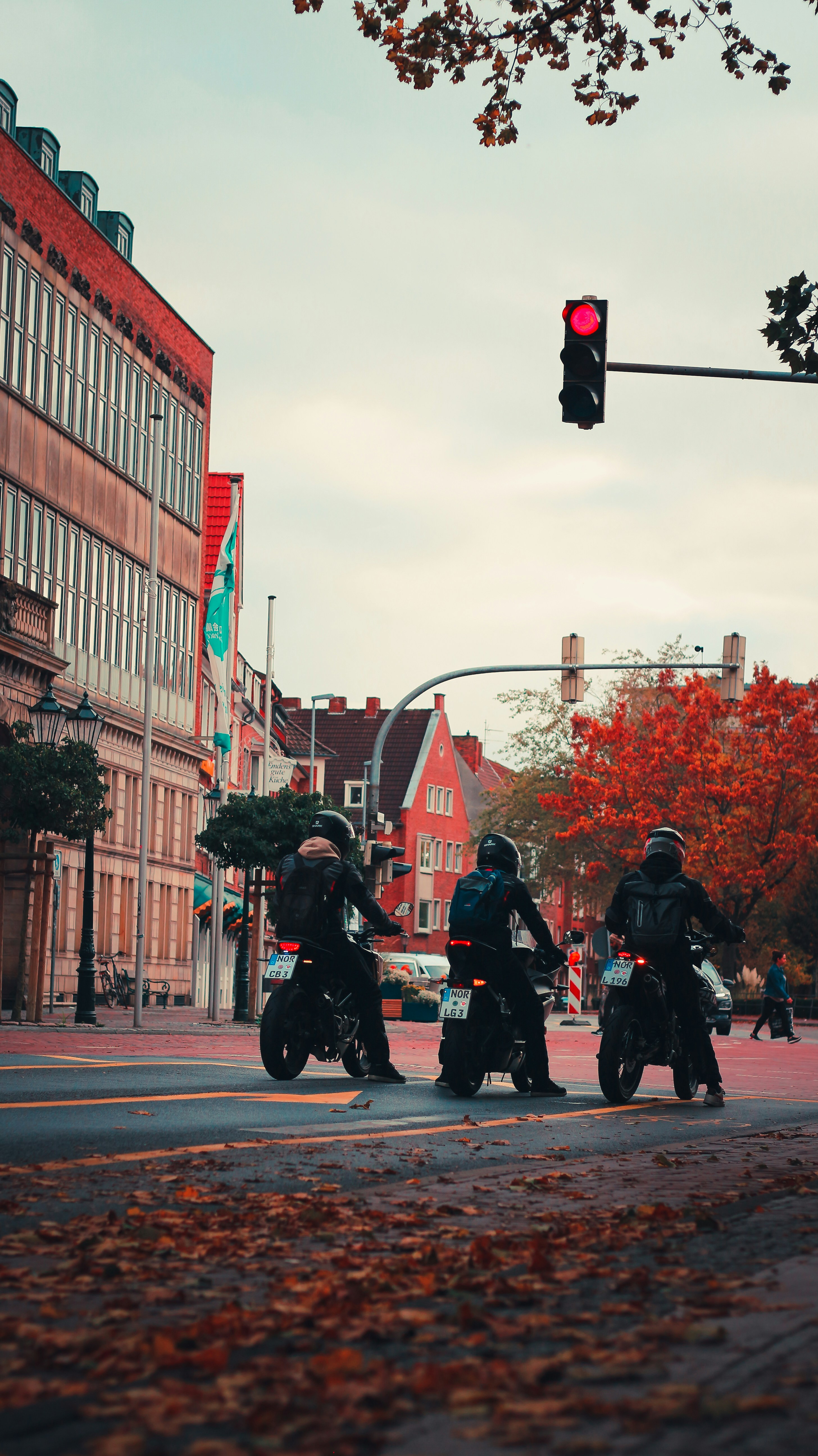 A group of people ride motorcycles down a street photo – Free Emdeck ...