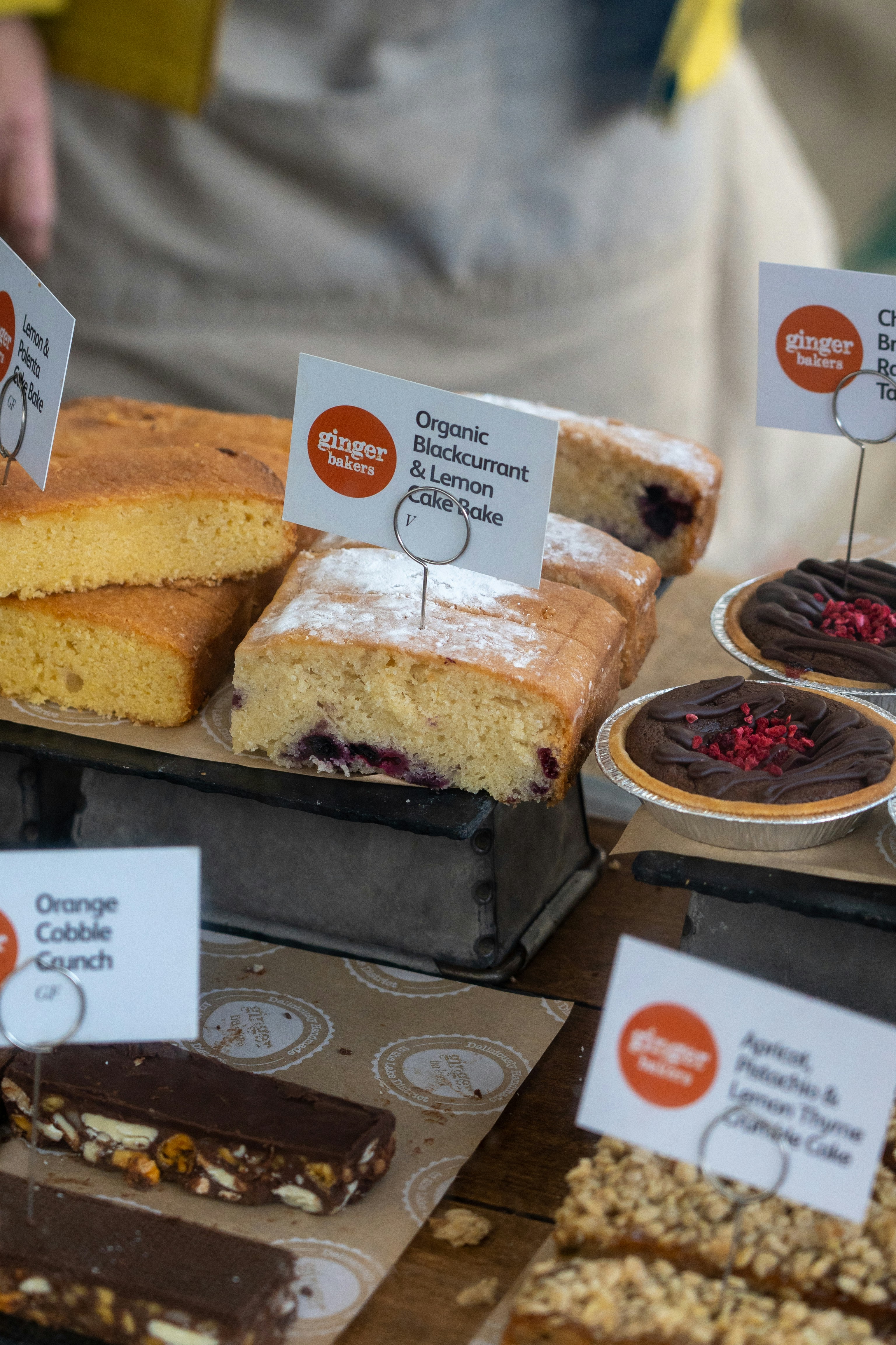Berry-Lemon Cake Slice Framed by Branded Bakery Labels