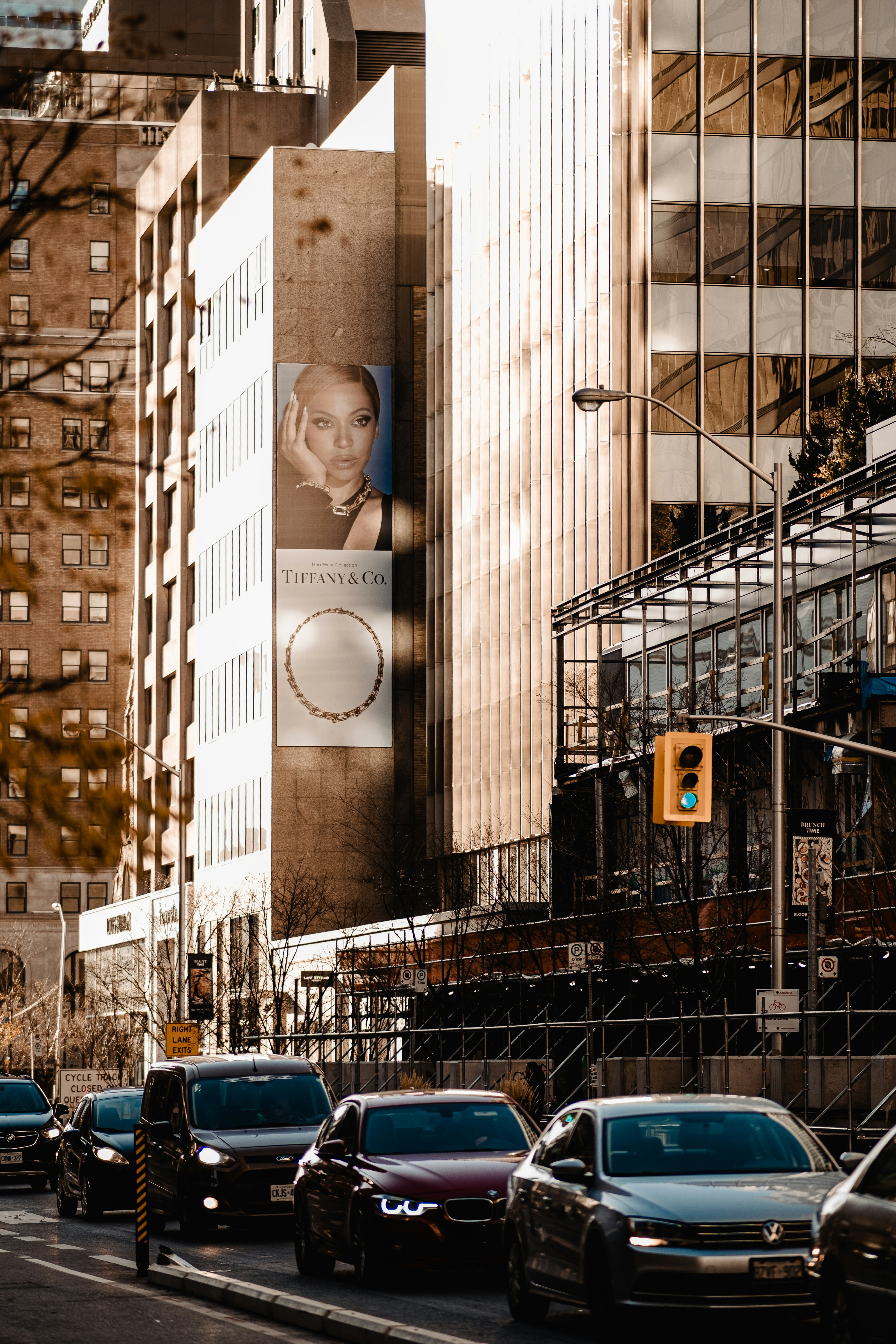 Tiffany Banner Rising Over a Rush-Hour Downtown