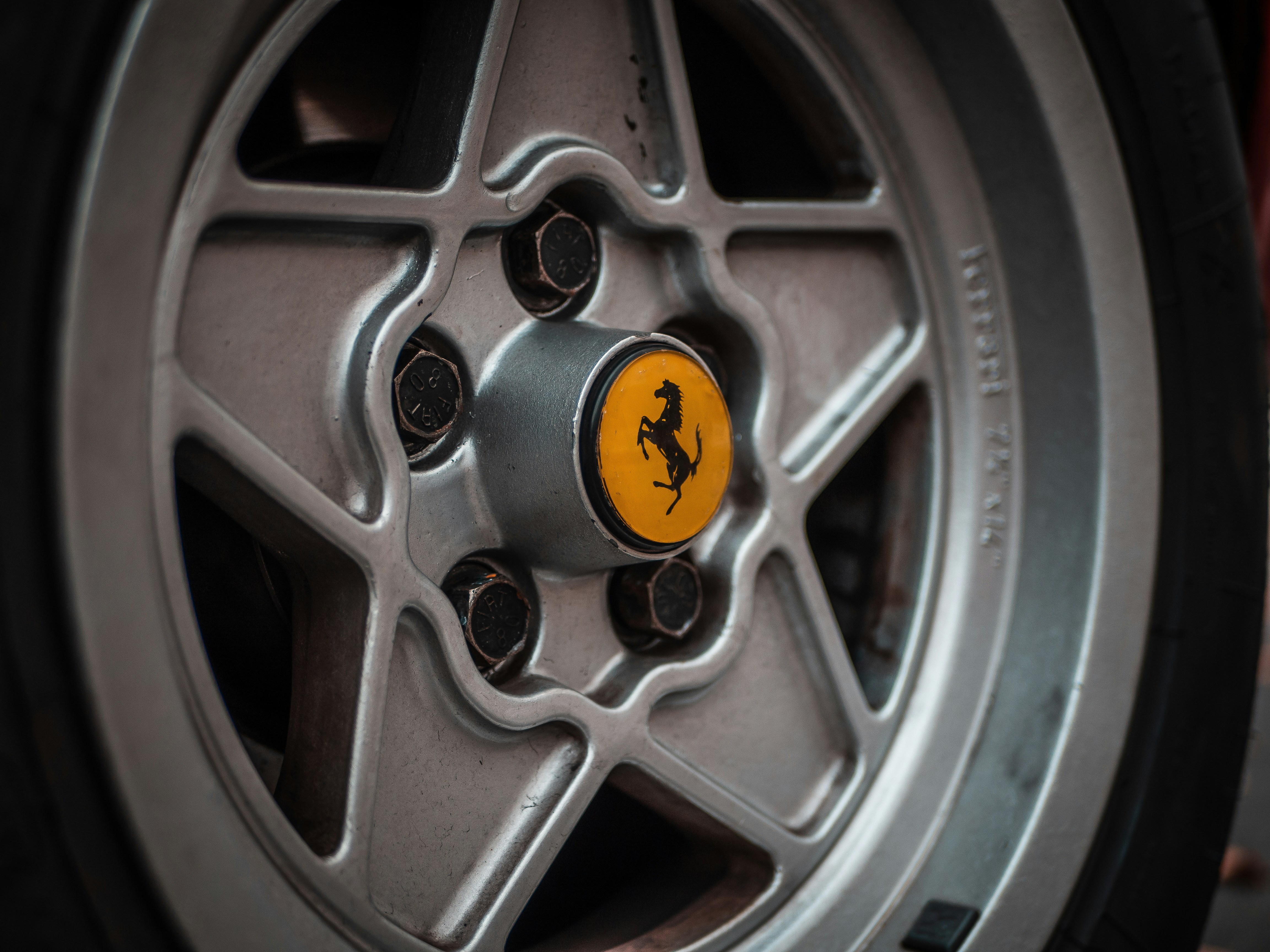 A close up of a car wheel photo – Free Reidholz garage ag Image on Unsplash