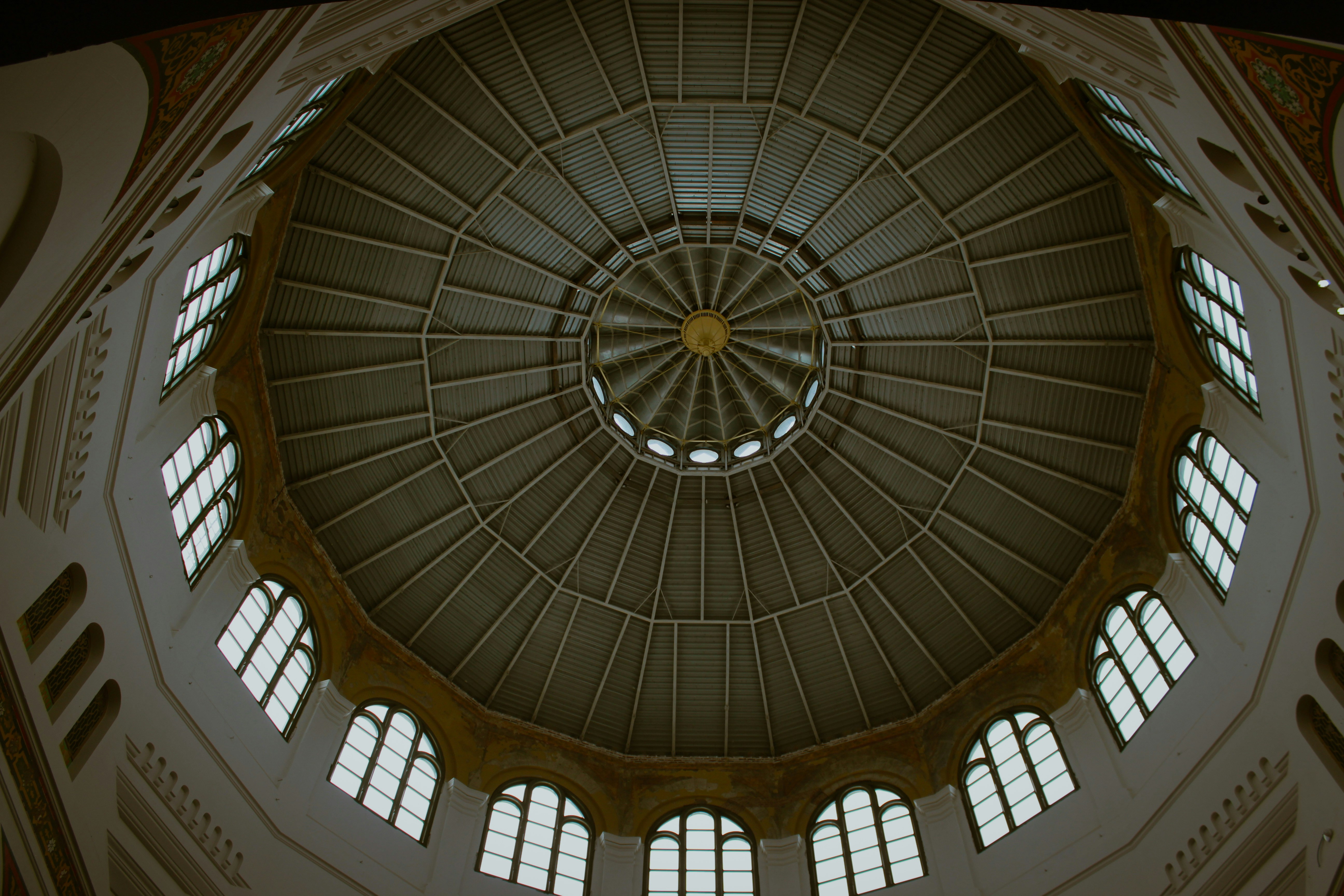 A large domed ceiling with a circular ceiling and many windows photo ...