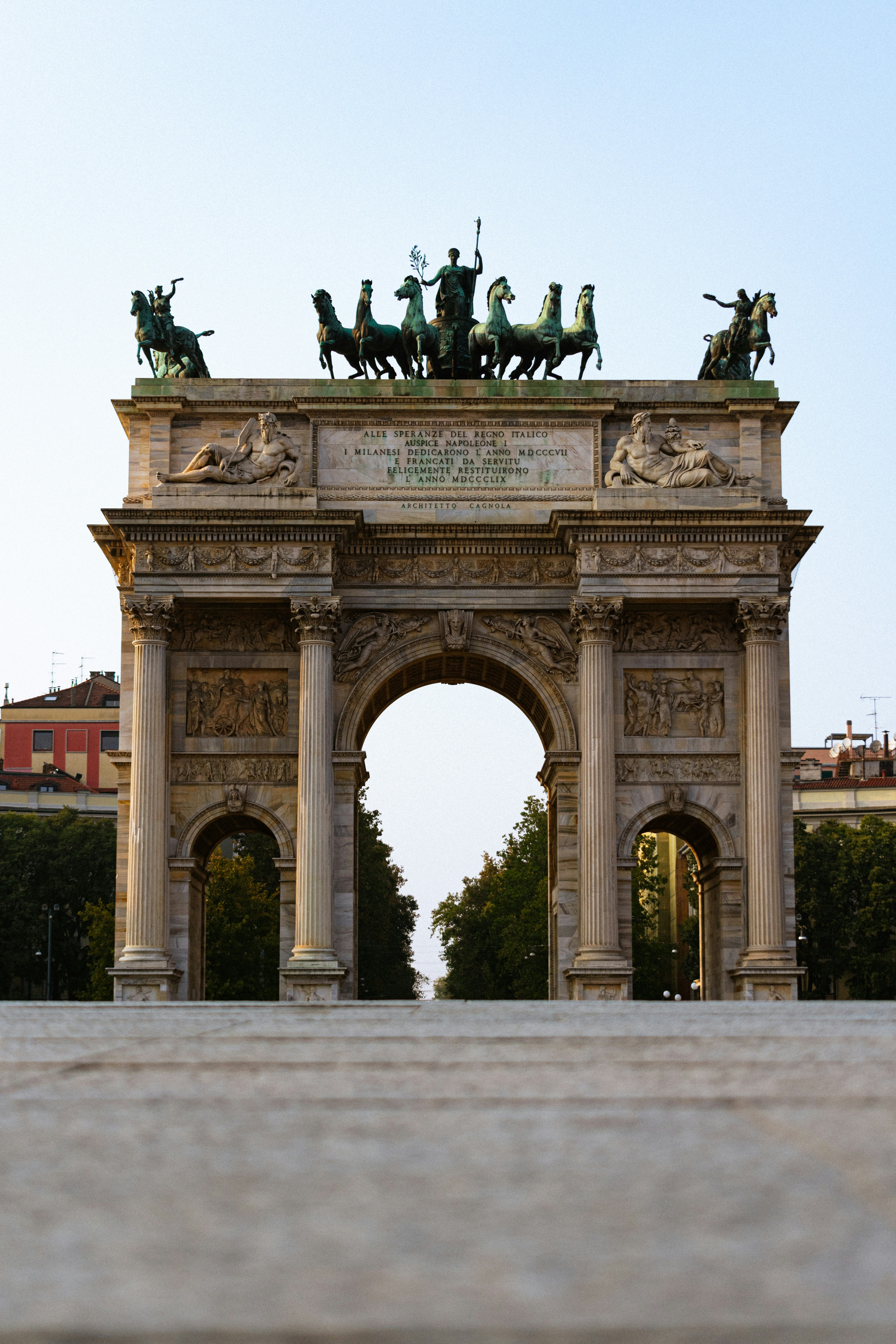 a large stone archway with statues on top of it