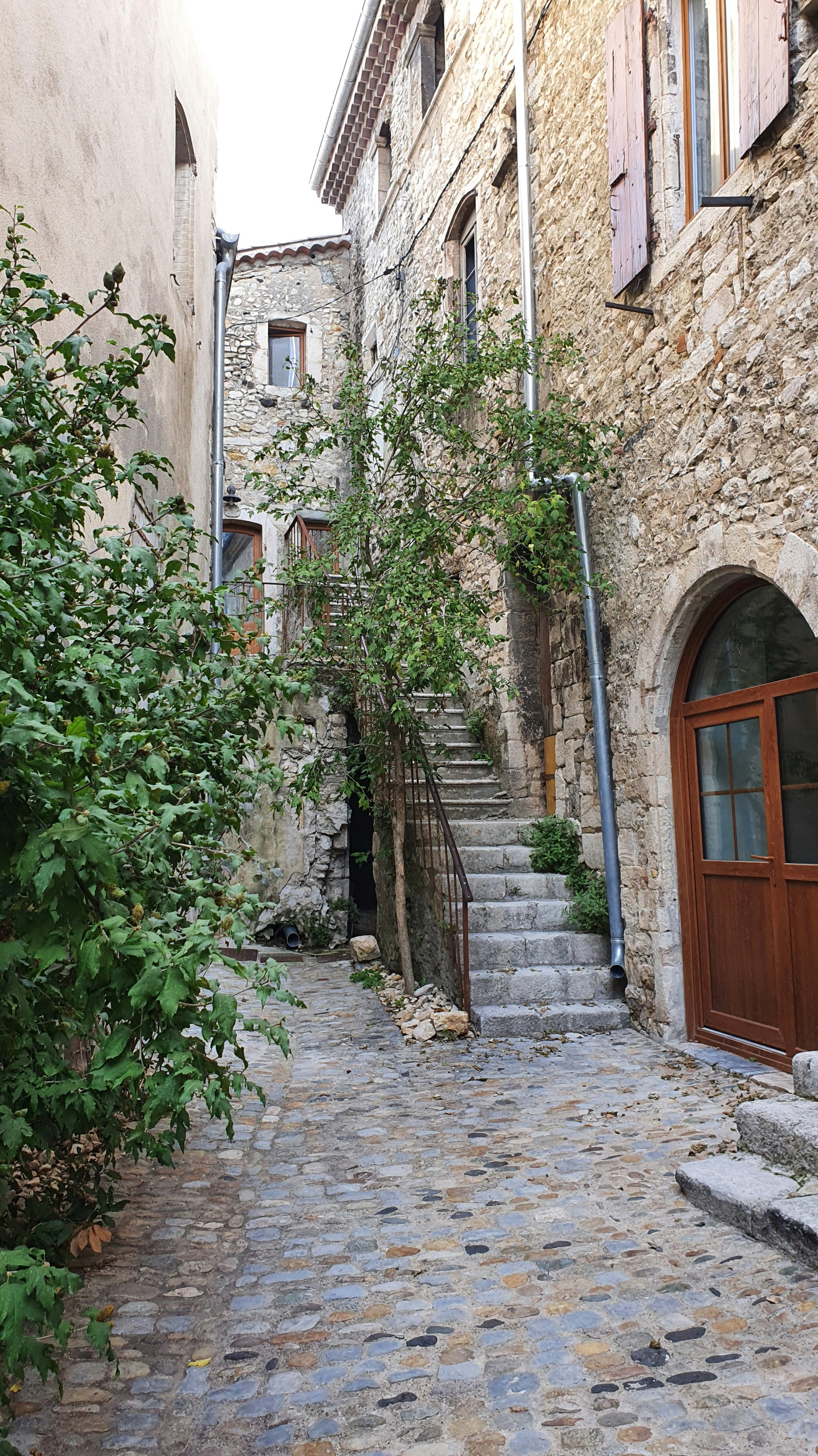 A stone path between buildings photo – Free City Image on Unsplash