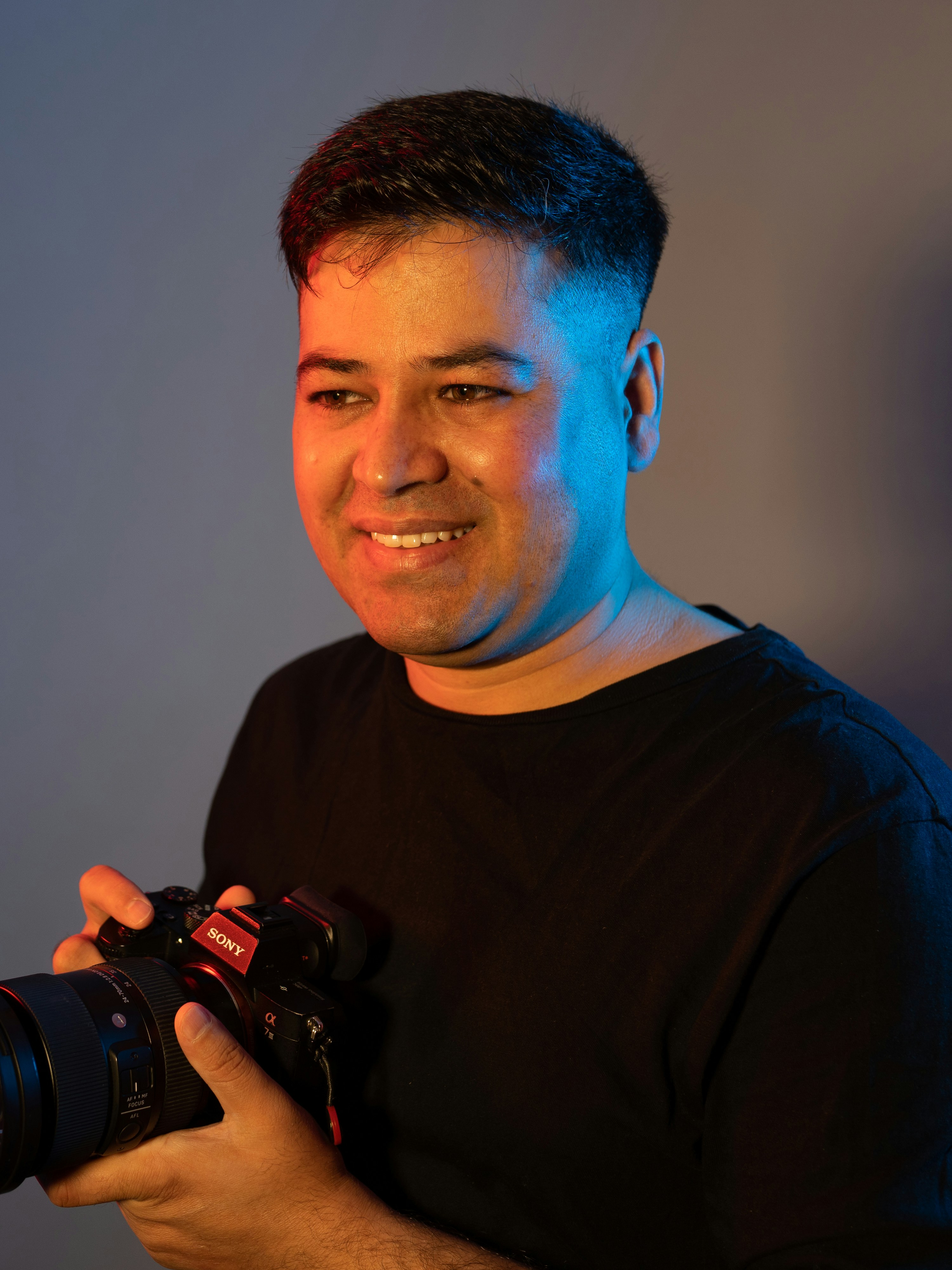 A man holding a camera photo – Free Image on Unsplash