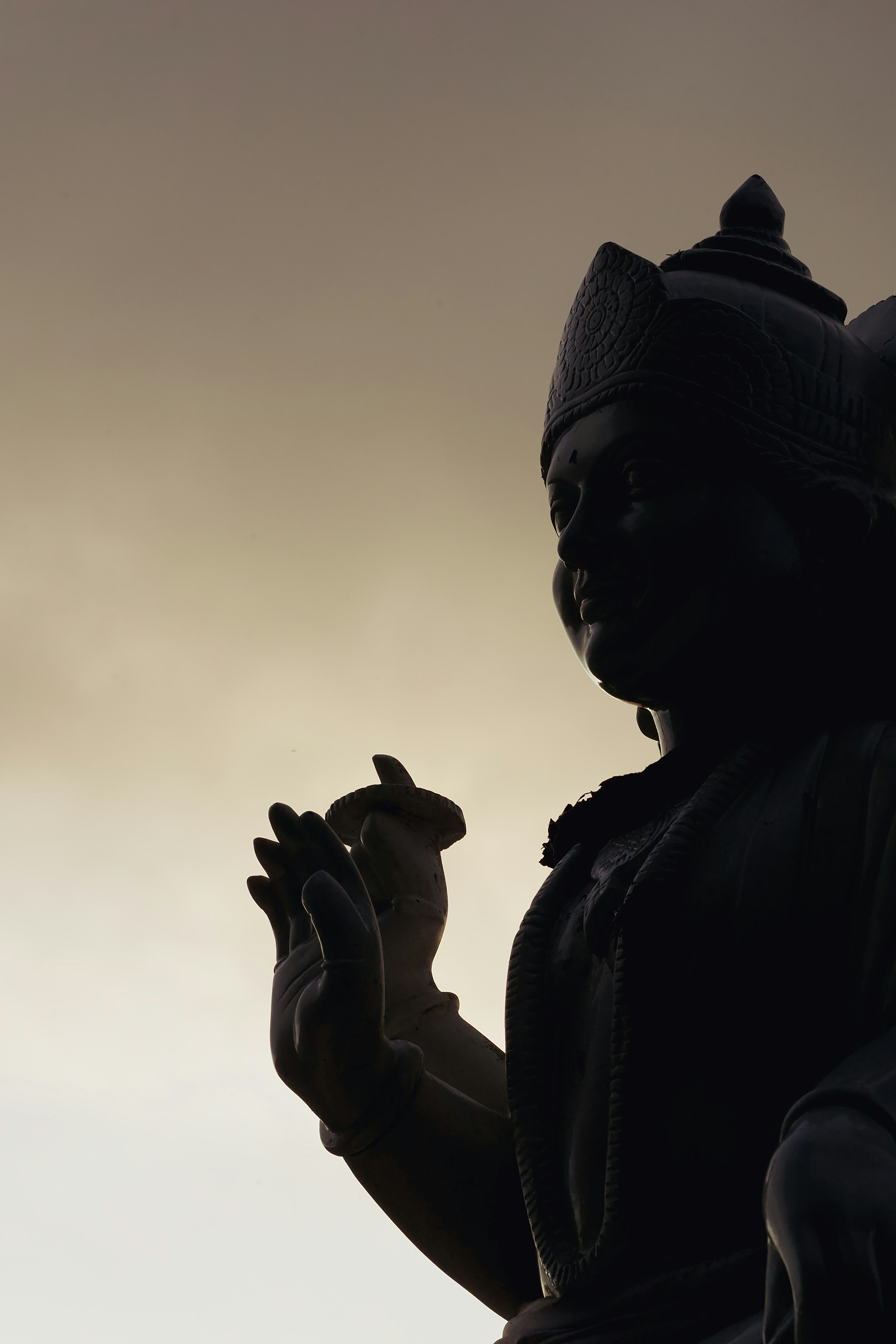 Silhouette of a Sacred Figure Against the Dusk