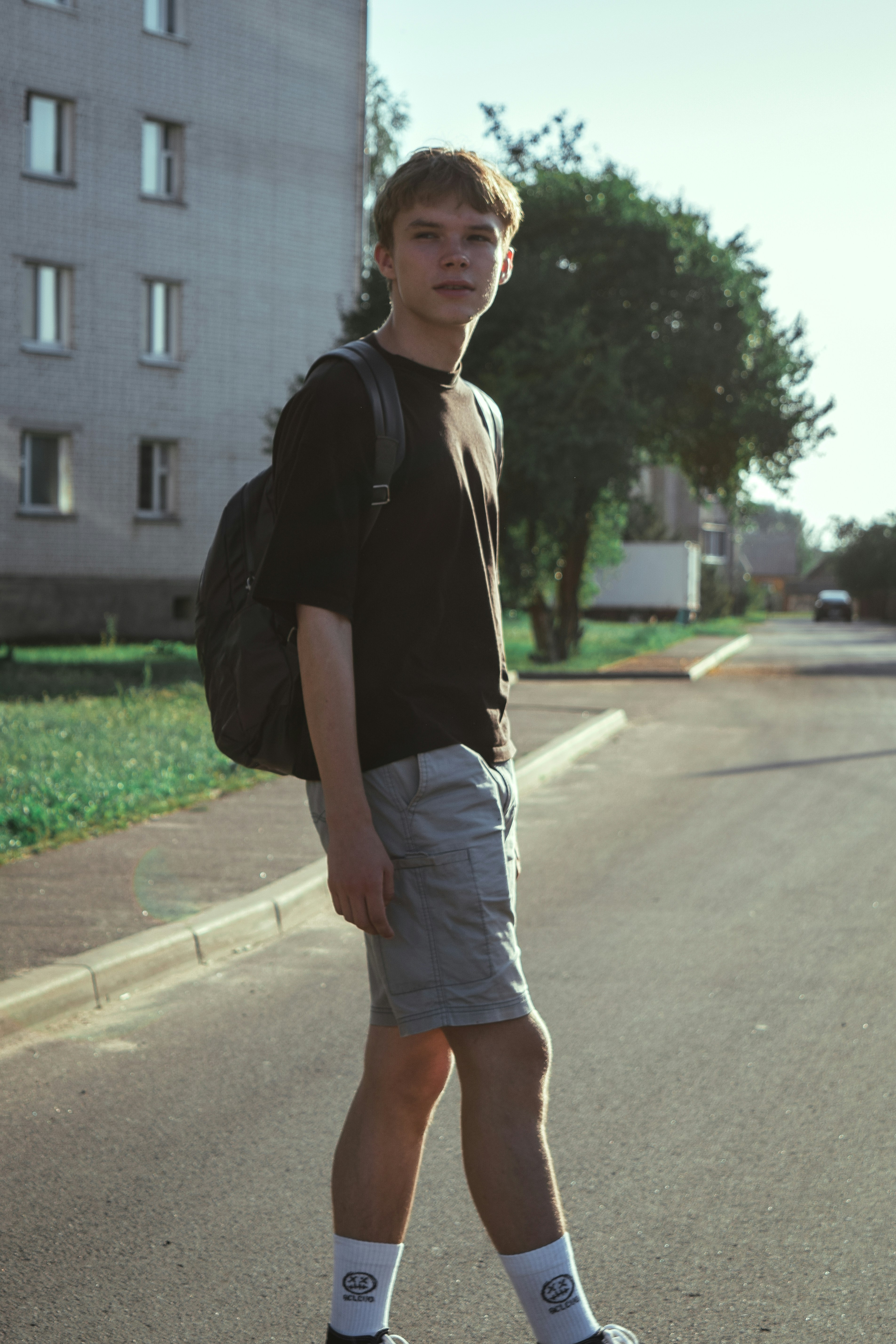 Youthful Stroll: A Quiet Portrait in Suburban Light
