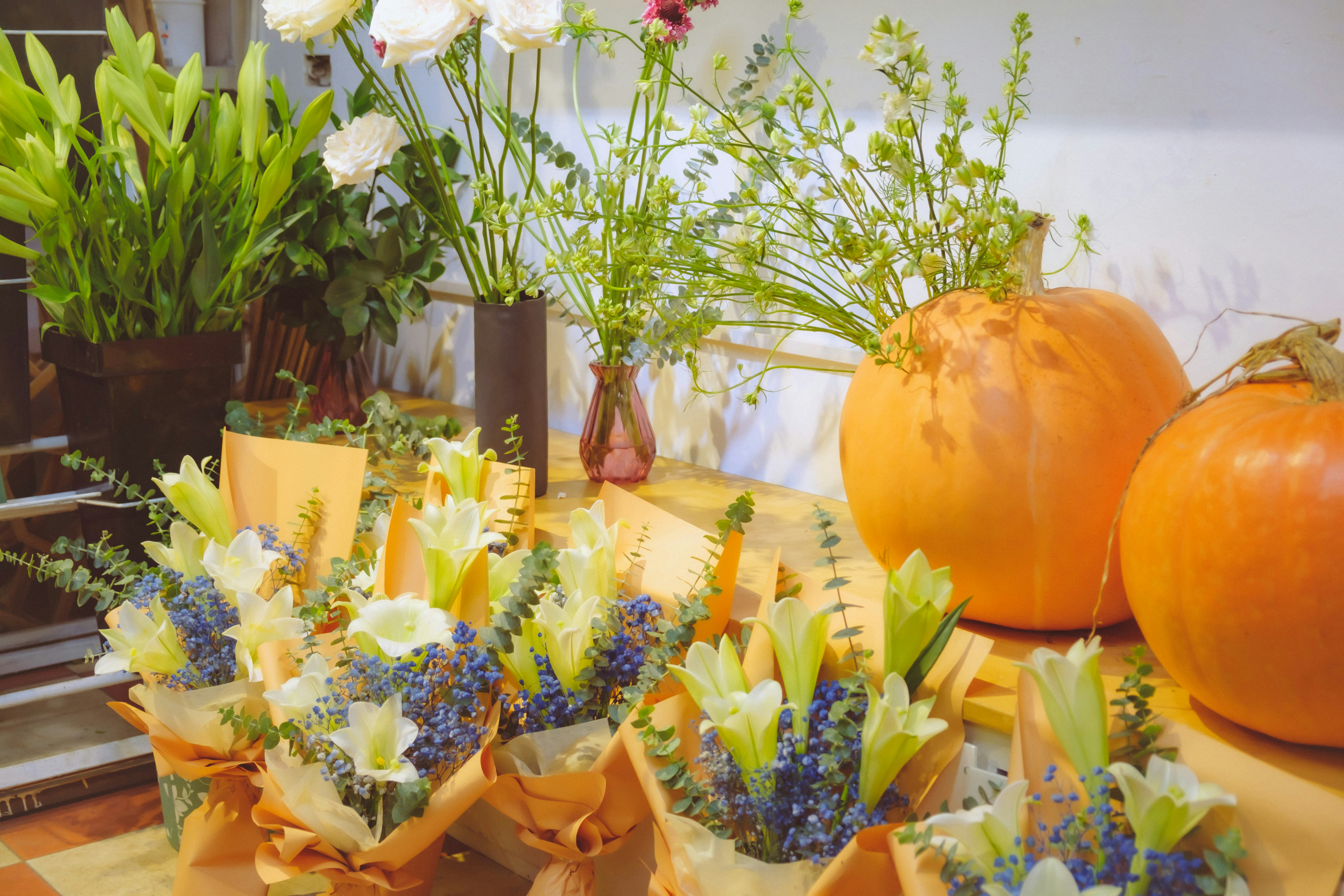 Autumn Bouquet Harvest: Pumpkins and Florals on a Sunlit Table