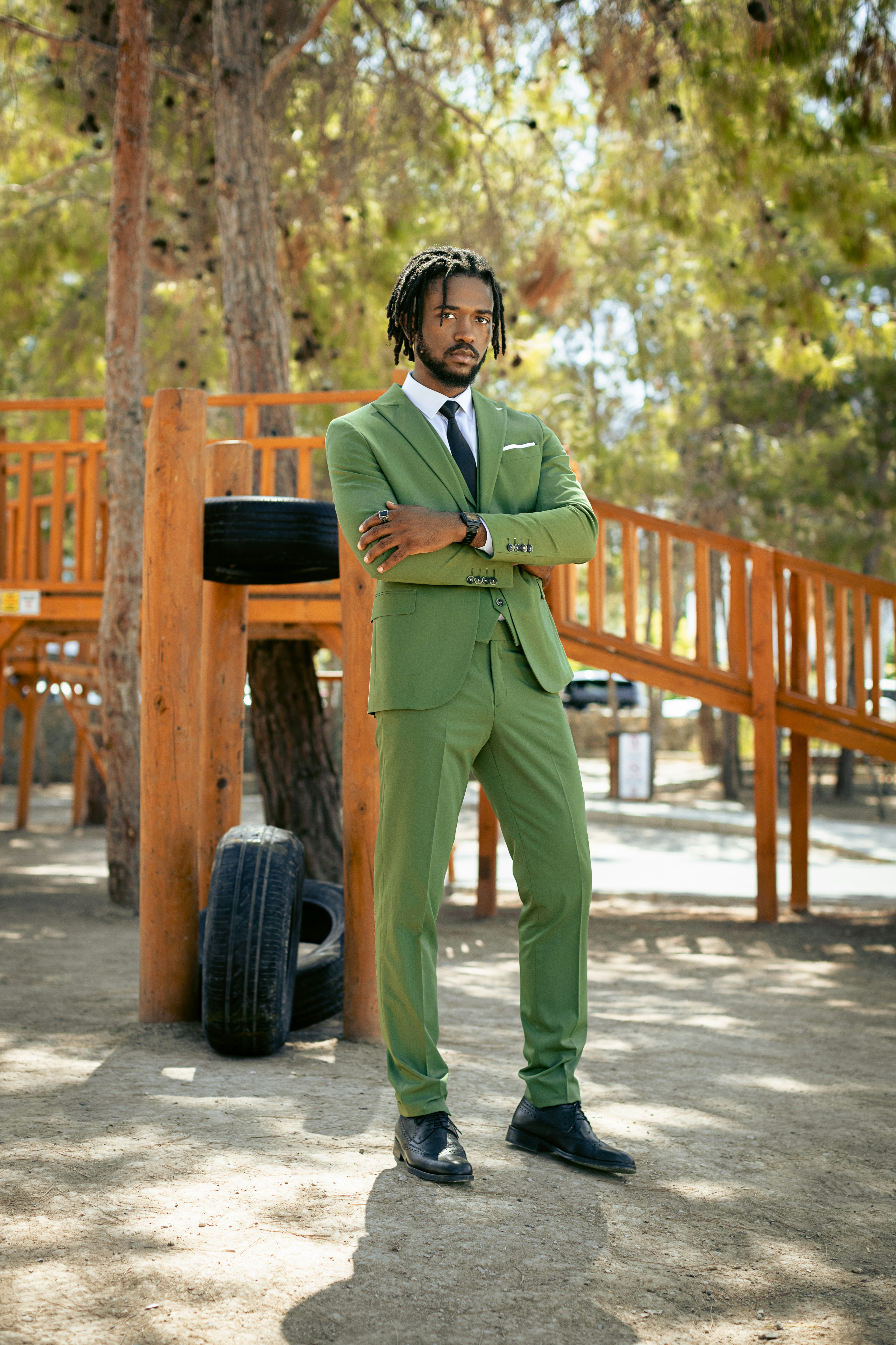 Emerald-Suit Confidence: A Sharp Stance in a Green Ensemble