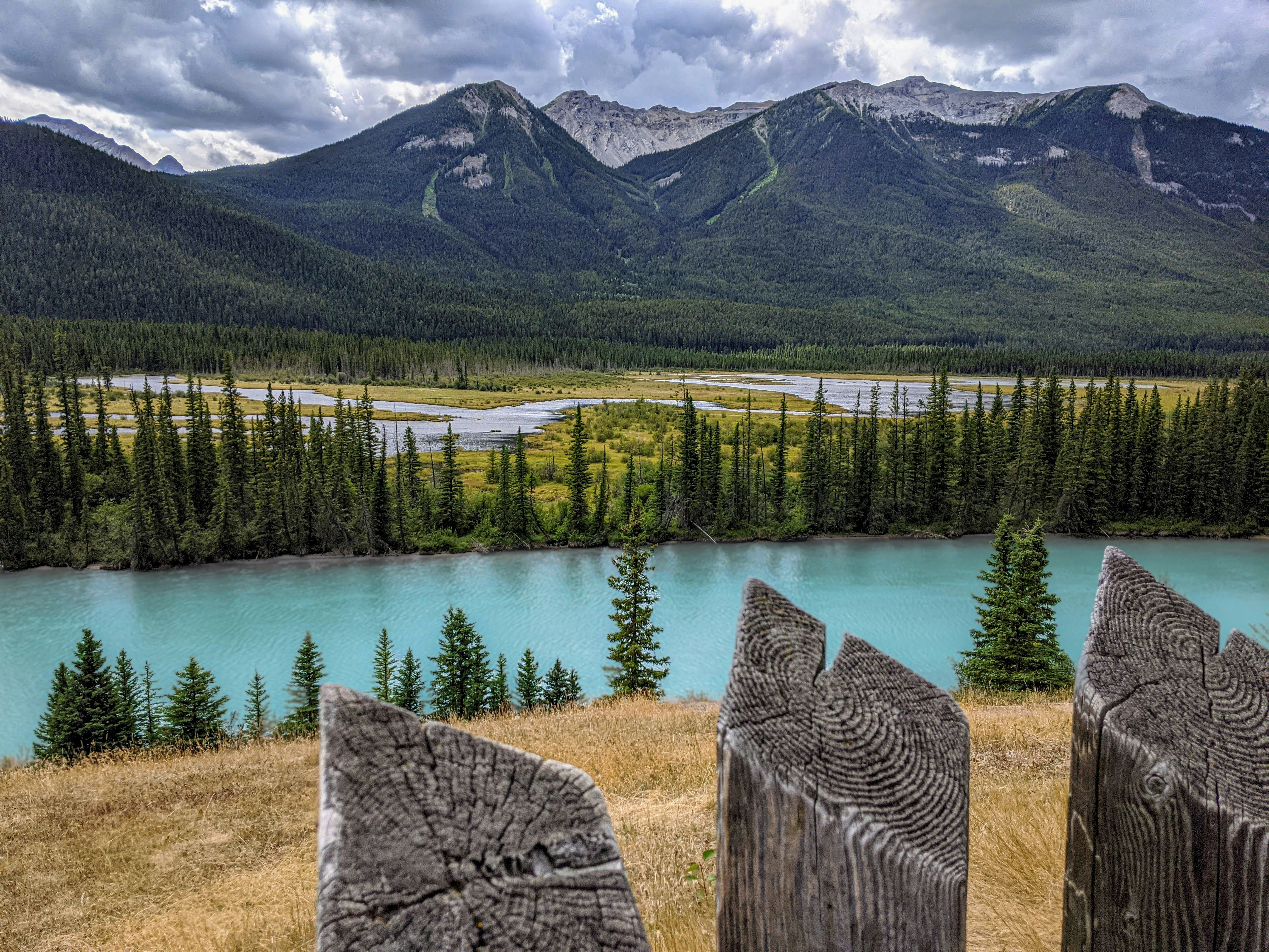 Turquoise River Meanders Through Alpine Valley