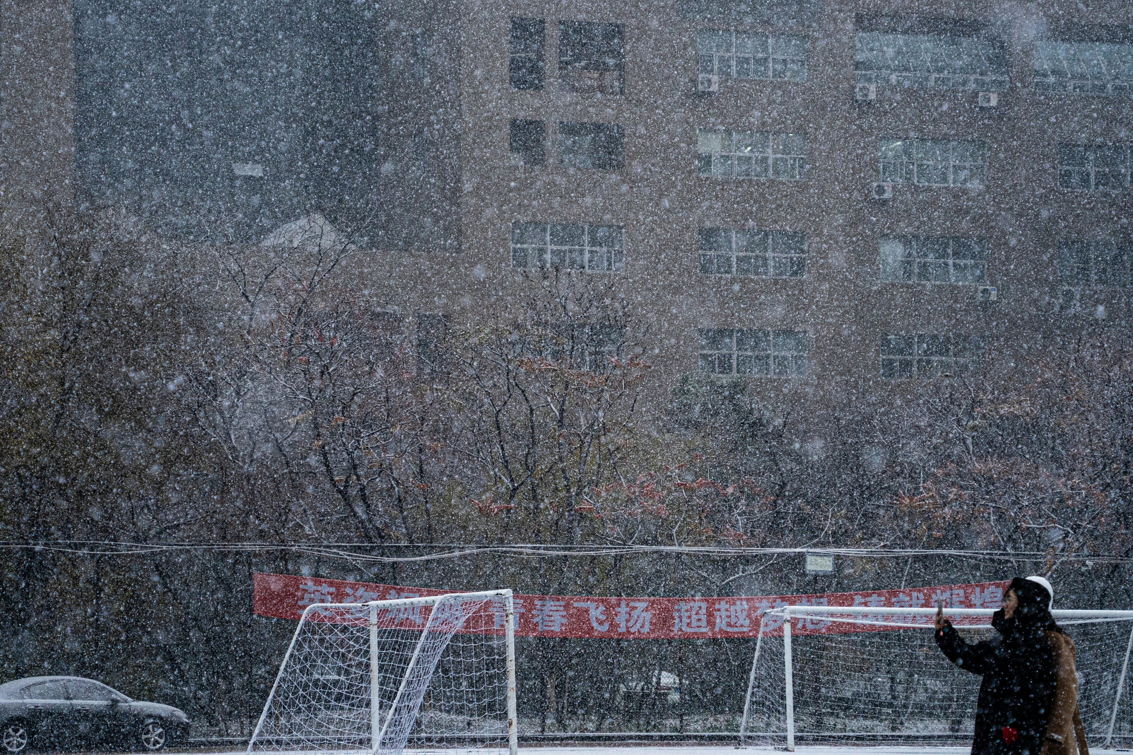 Snowfall Over the City Goal: A Lone Figure in Frosty Silence