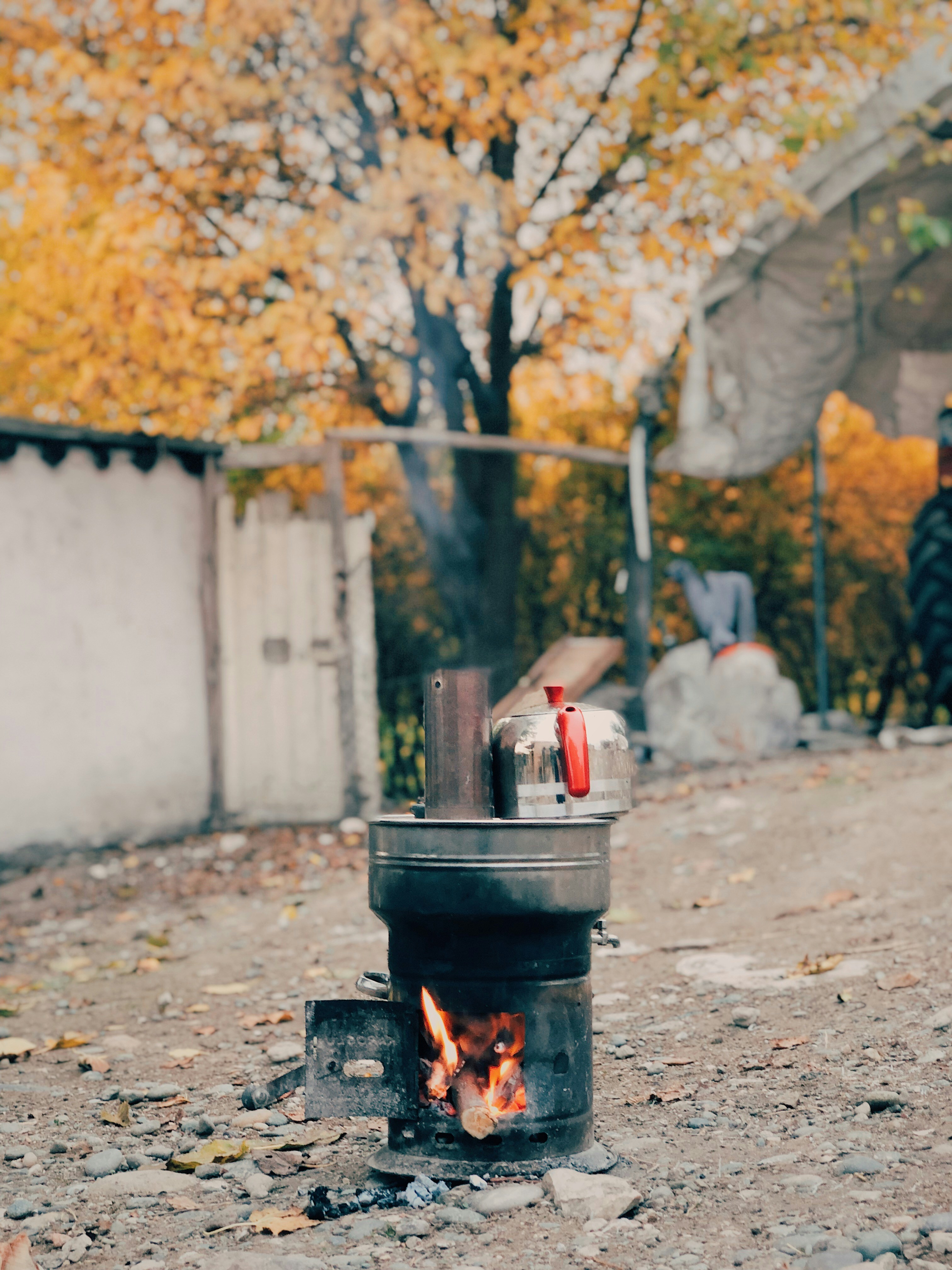 Ember in the Gravel: A Kettle Braving Autumn Fire