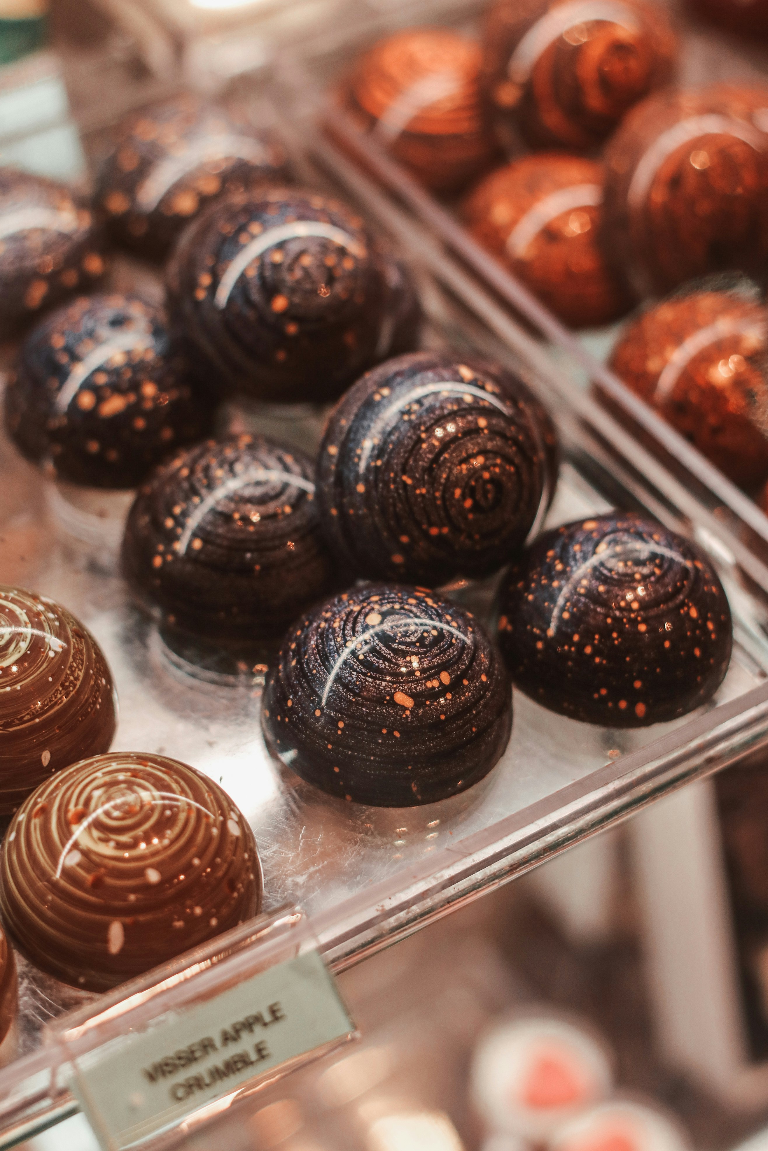 A group of chocolates on a shelf photo – Free Chocolate Image on Unsplash
