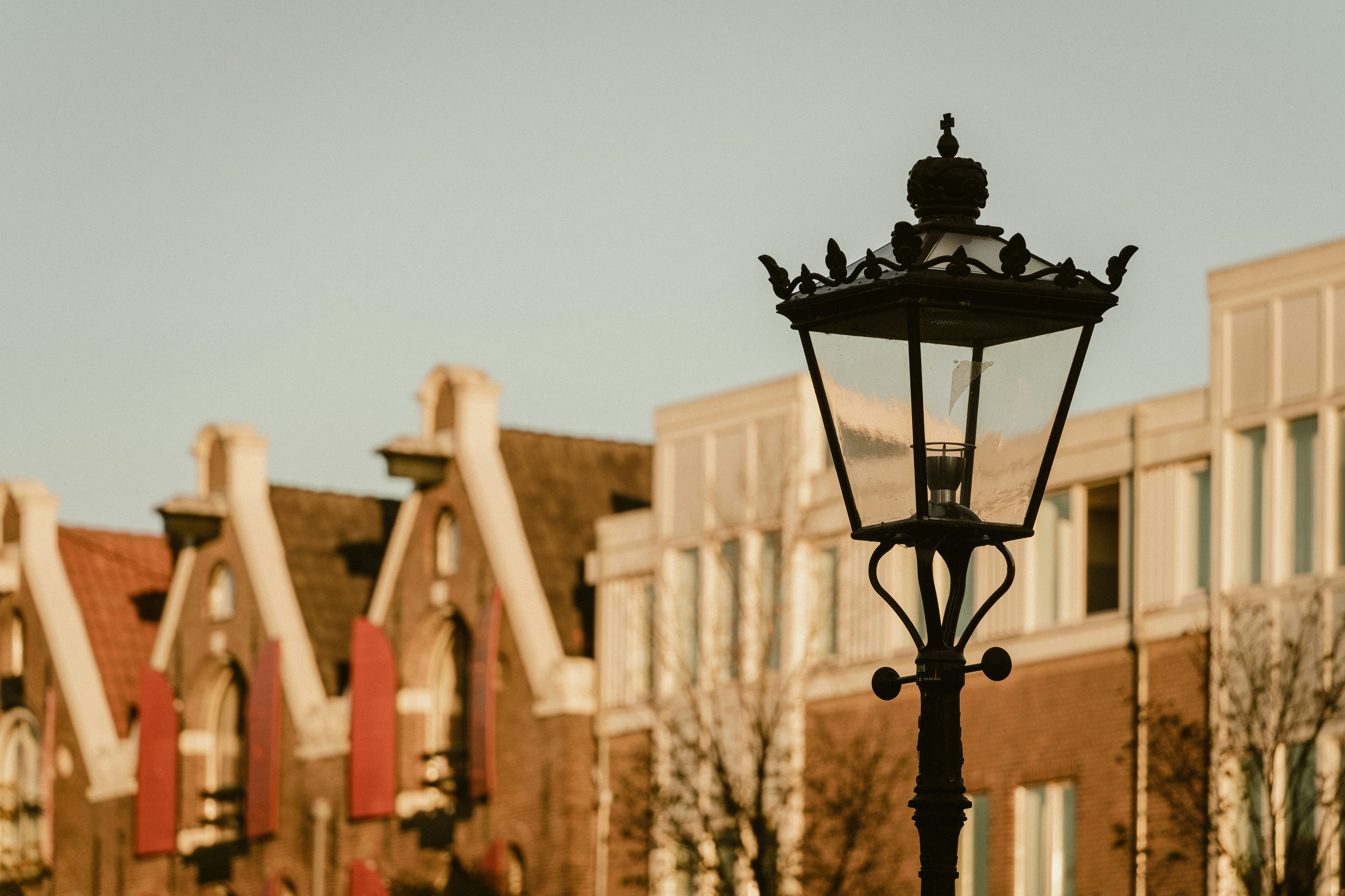 A lamp post in front of a row of buildings photo – Free Amsterdam Image ...