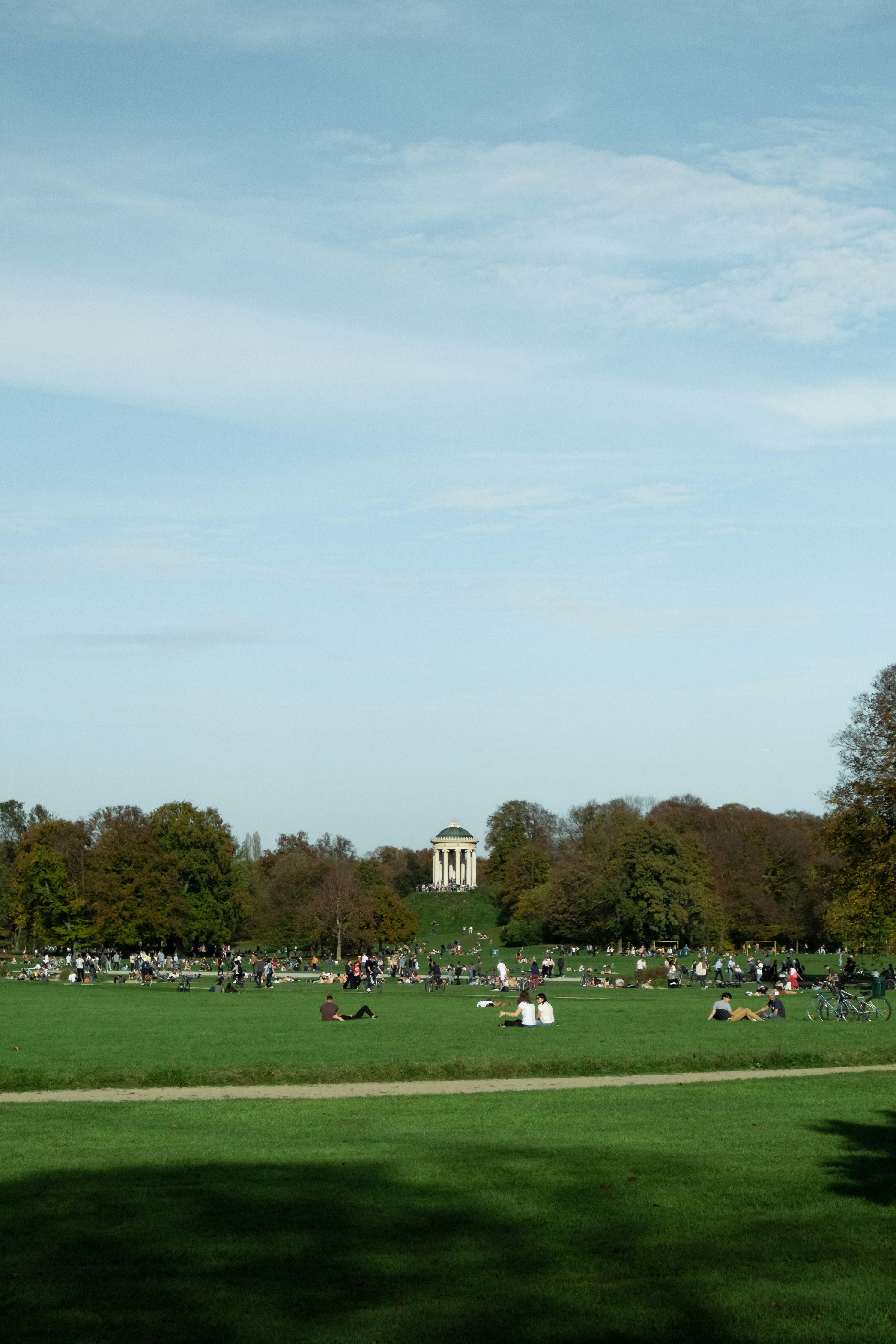 Green Expanse with a Classical Temple Framing the Horizon
