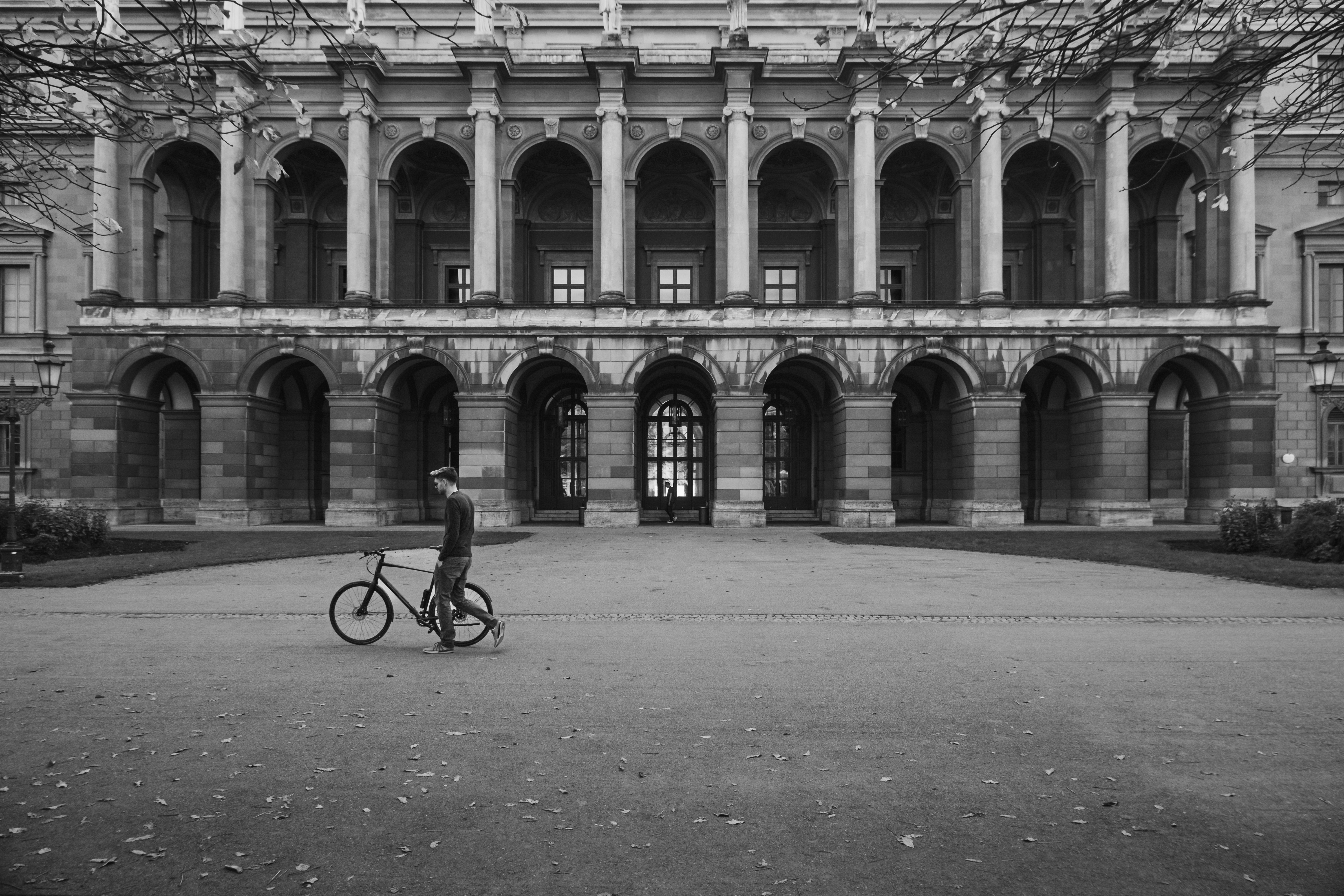 Bike Between Arches: A Quiet Moment Under a Monumental Facade