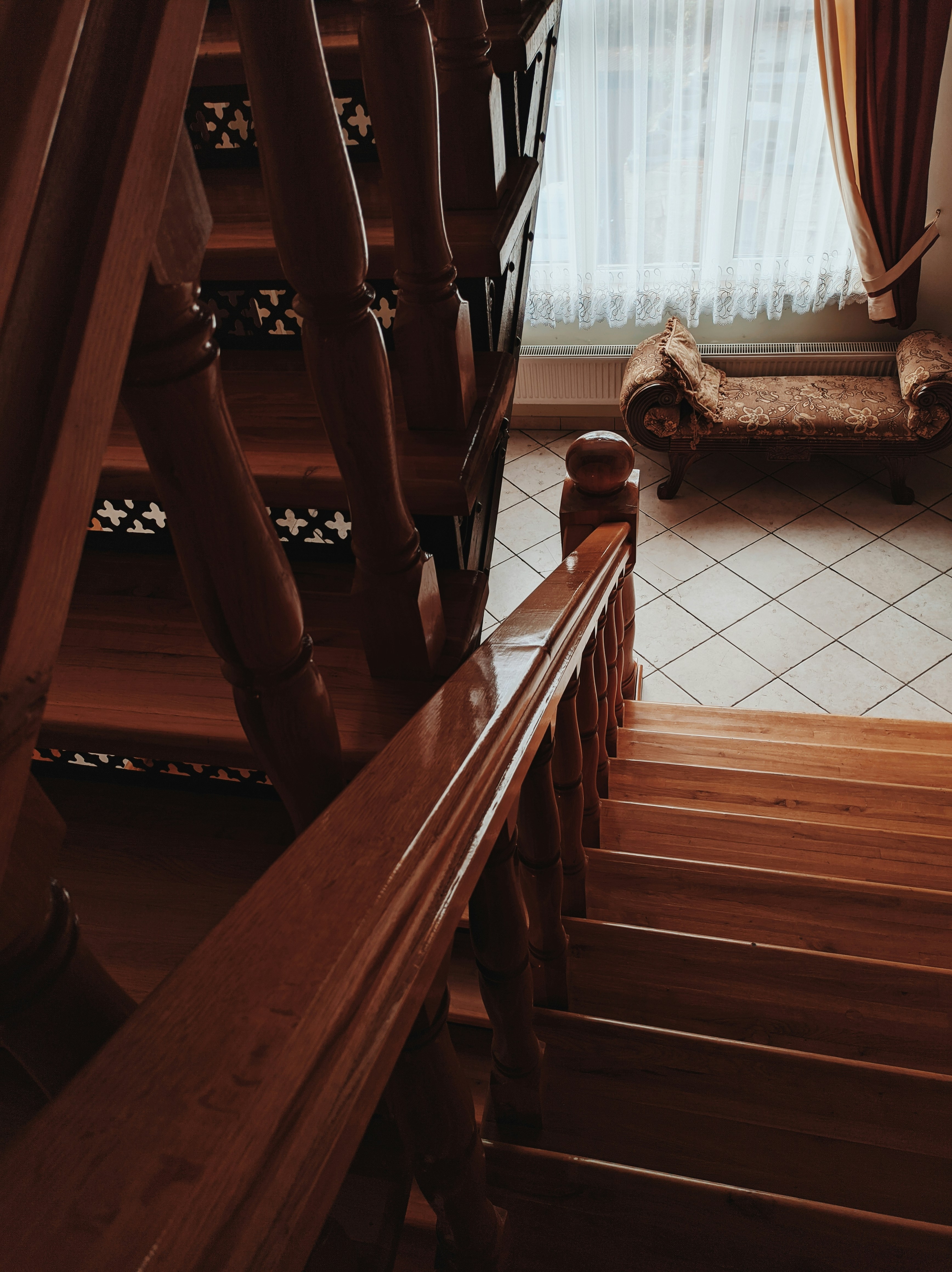 a wooden staircase with a window