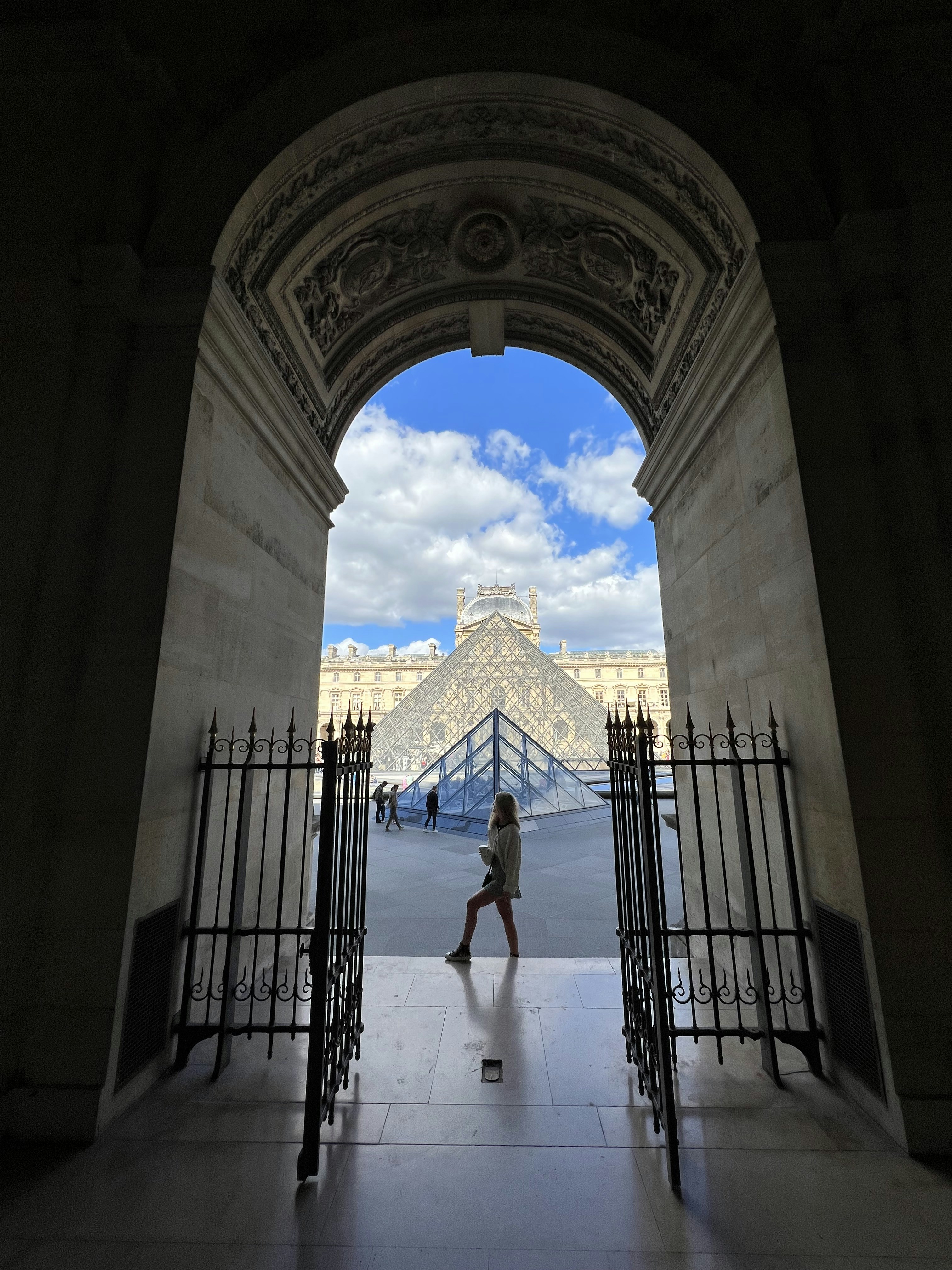 A person walking through a gate photo – Free France Image on Unsplash