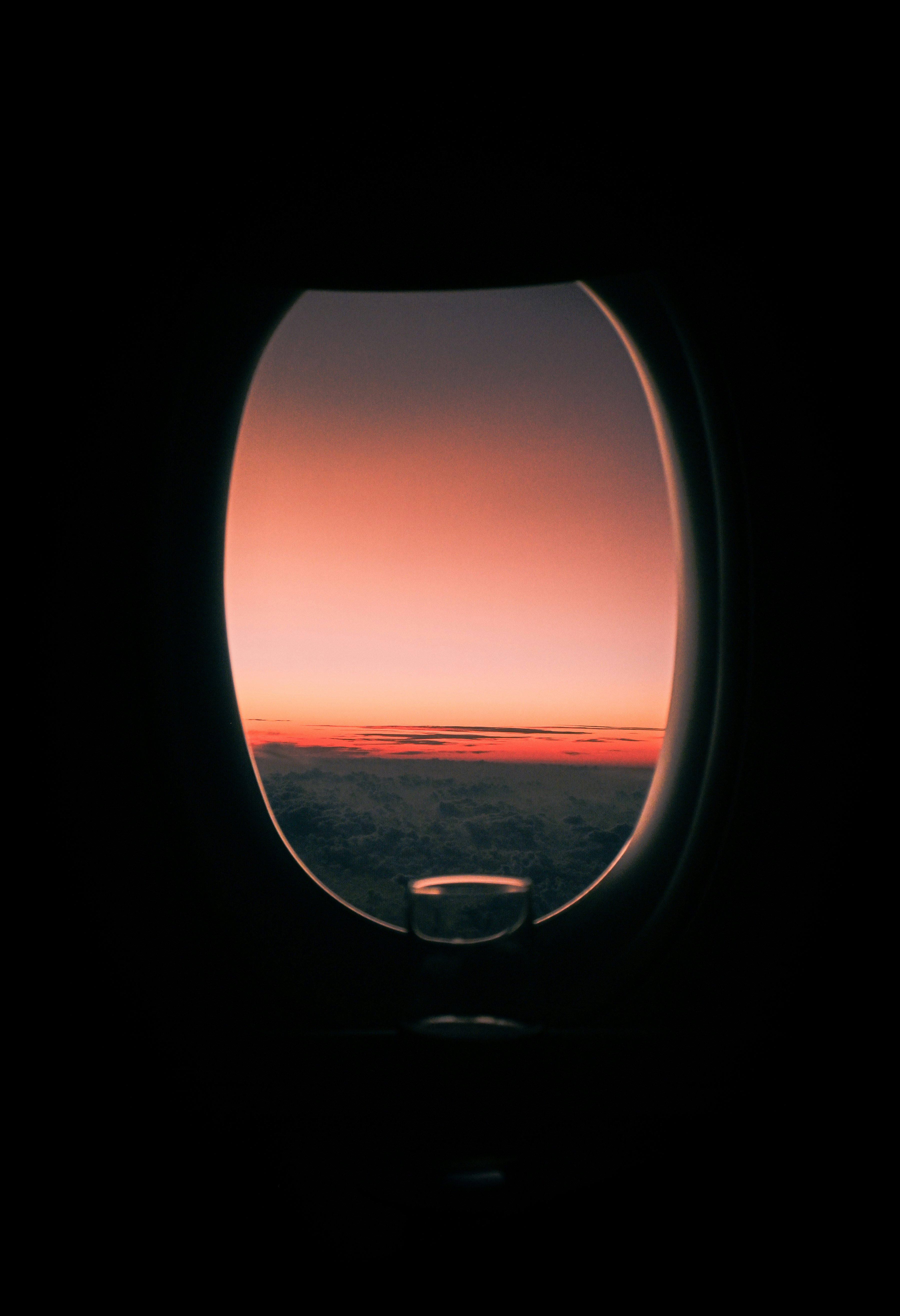 A view of a sunset through a window photo – Free Window Image on Unsplash