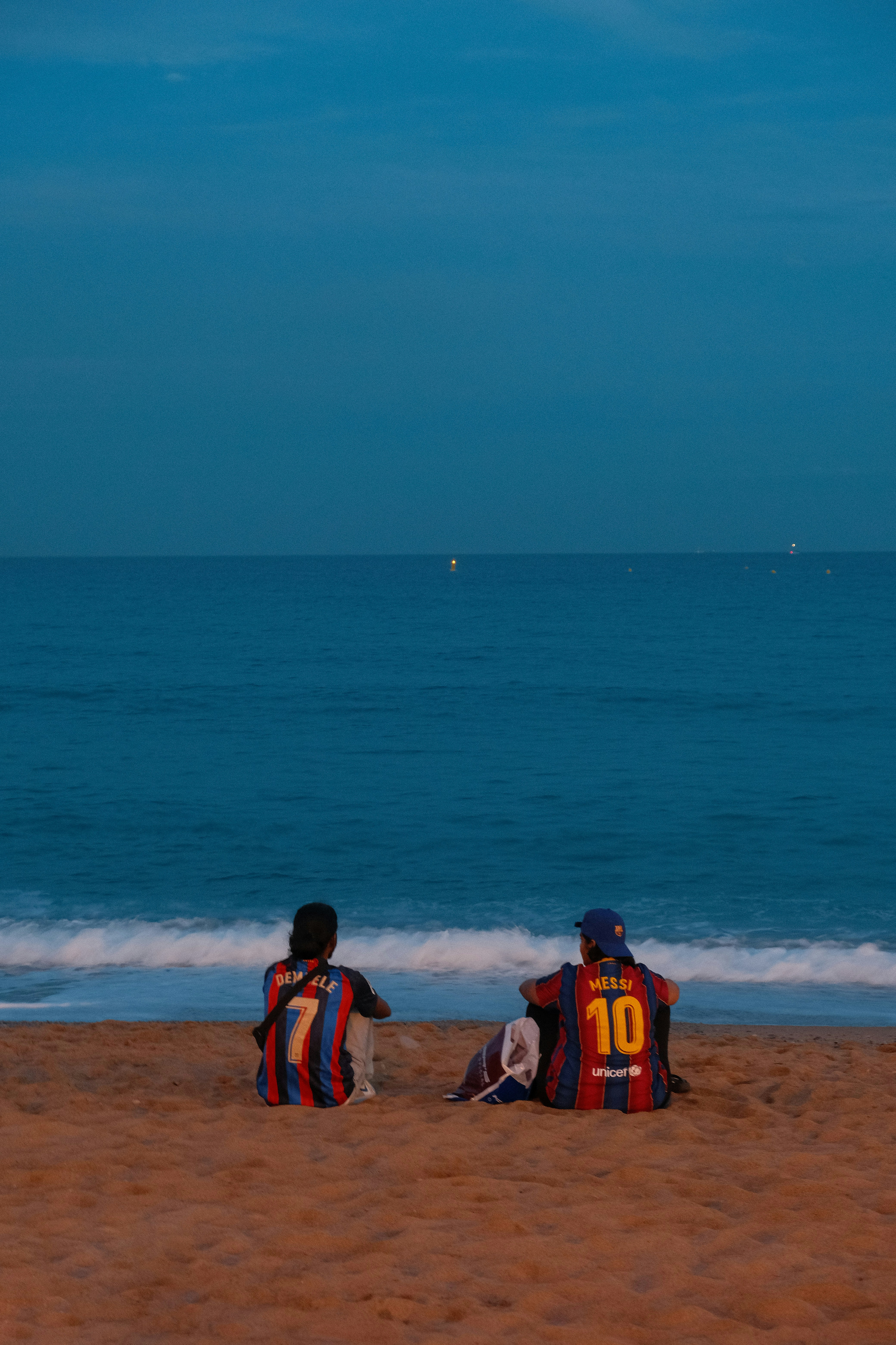 Barça Fans by the Blue Shore: Quiet Beach Portrait