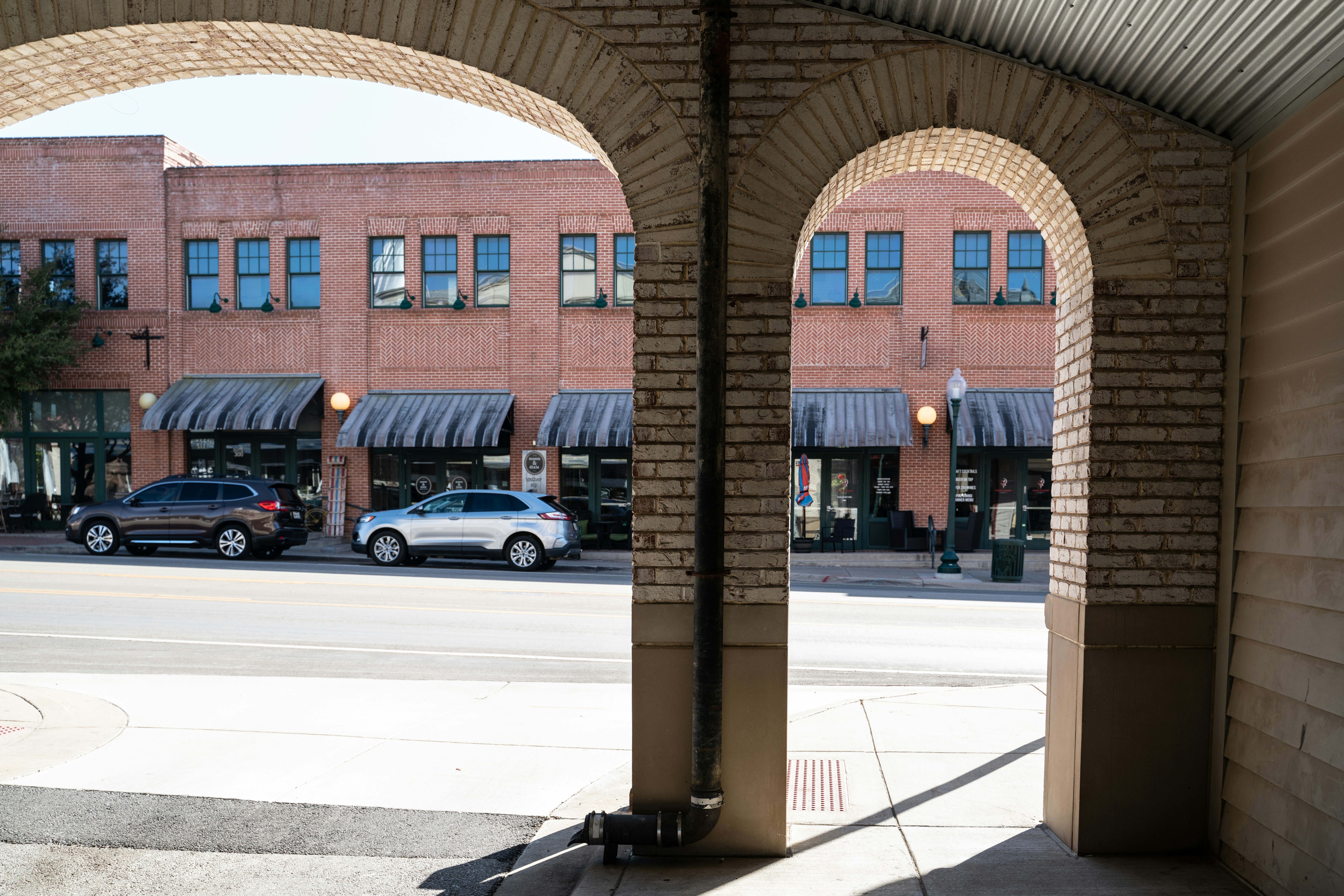 a street with cars parked on the side
