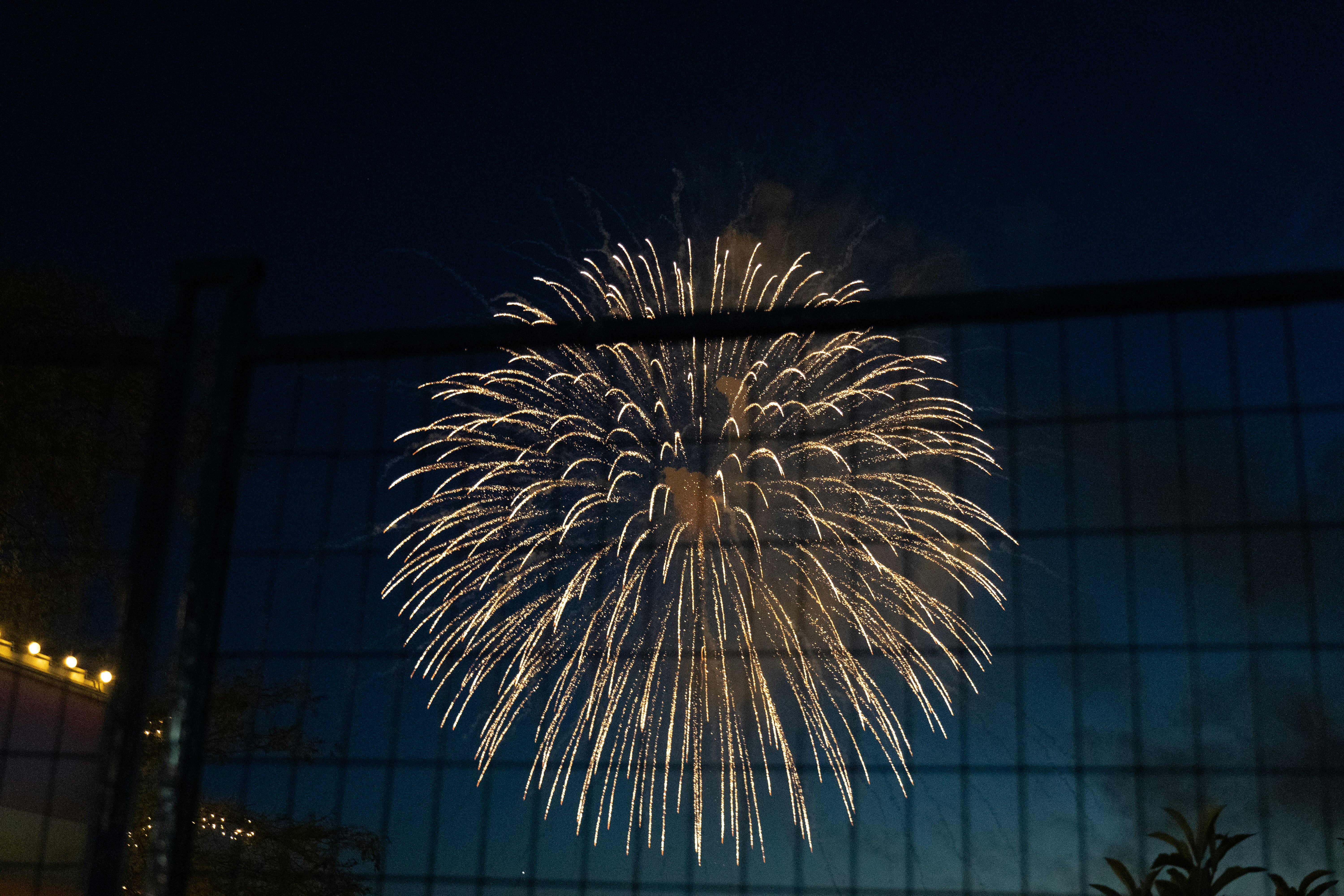 A large building with fireworks in the sky photo – Free Fireworks Image ...