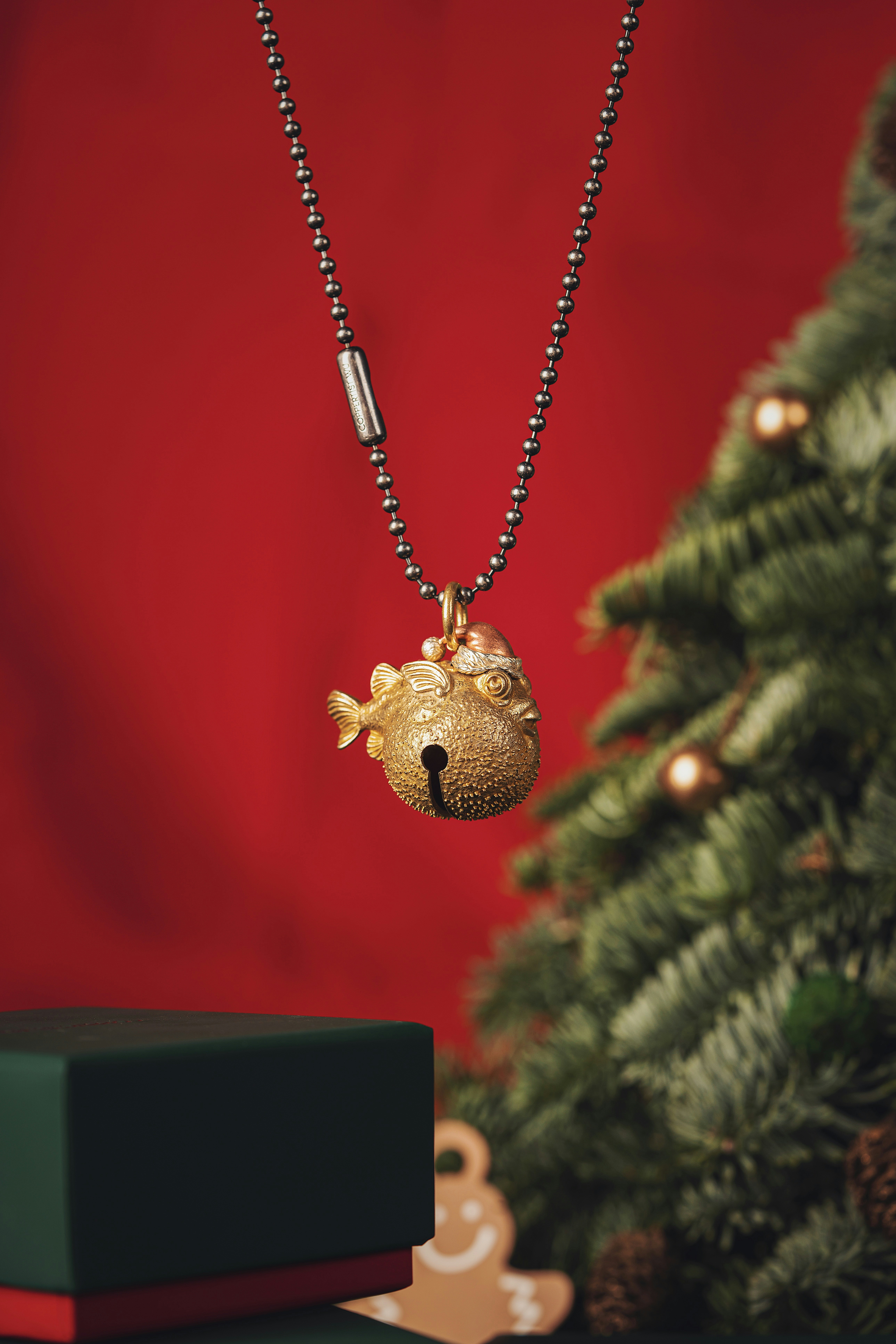 A small stuffed animal on a chain photo – Free Necklace Image on Unsplash