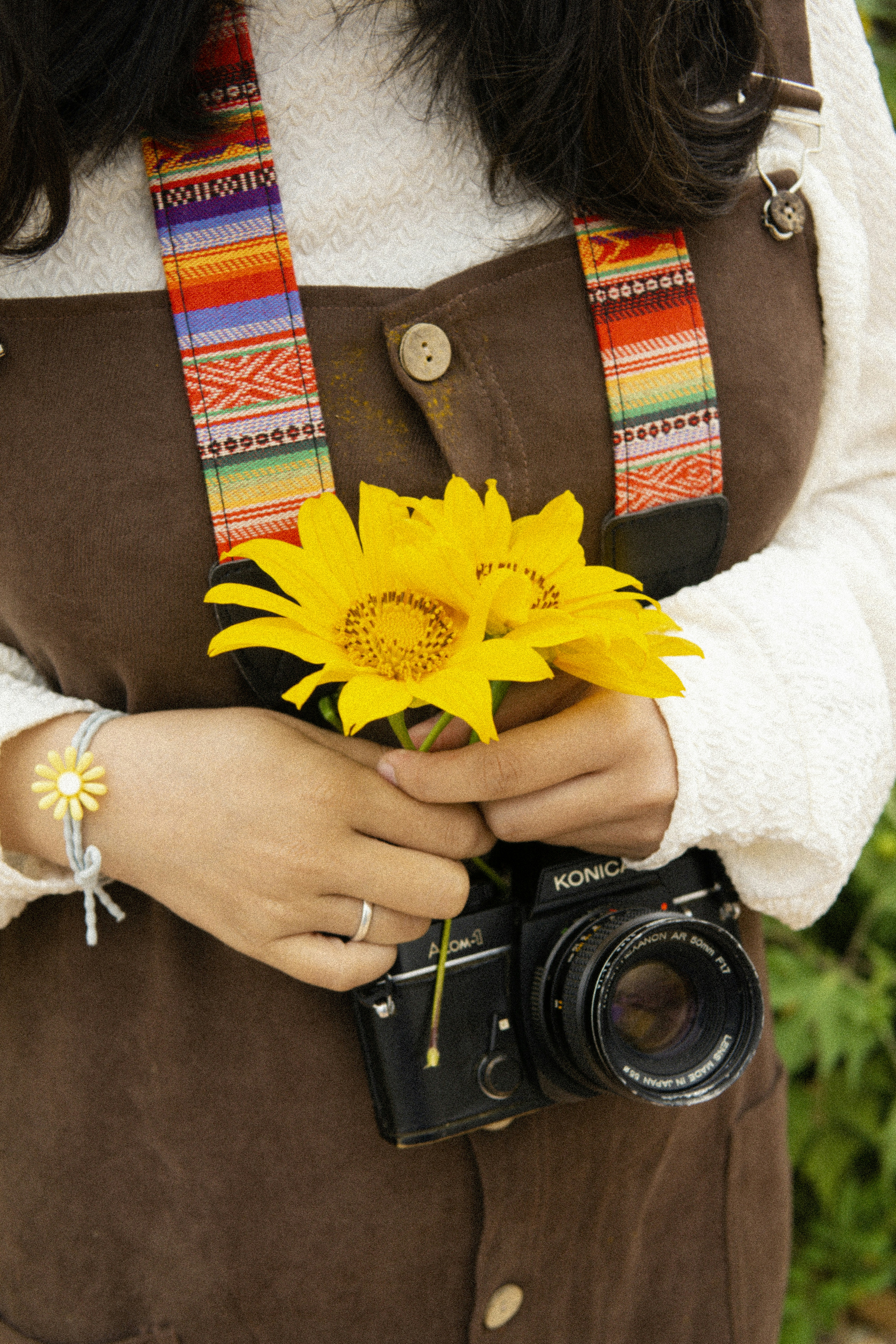 Sunflower in Hand, Lens Ready: A Quiet Portrait of Craft