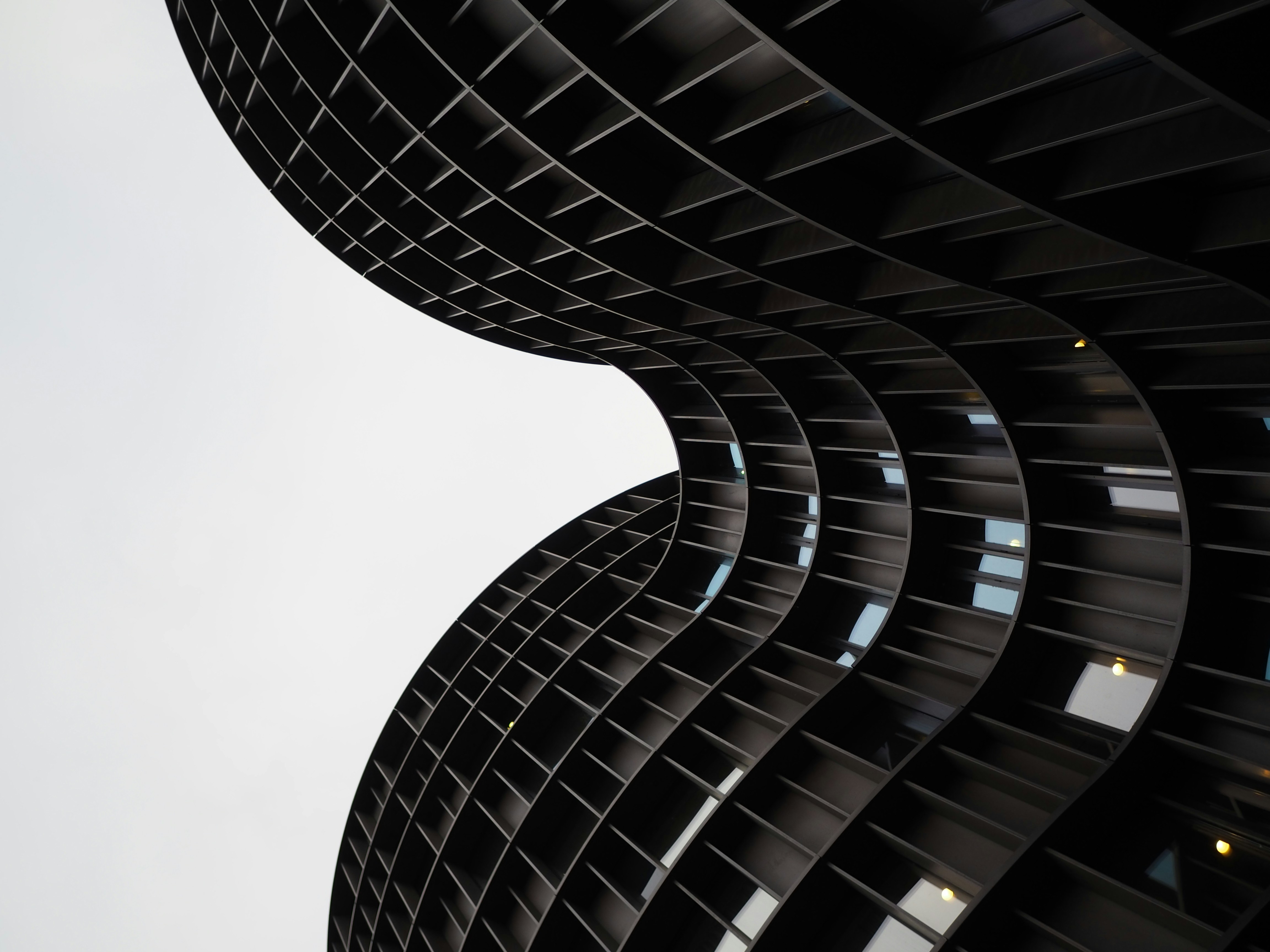 A tall building with many windows photo – Free Axel towers Image on ...