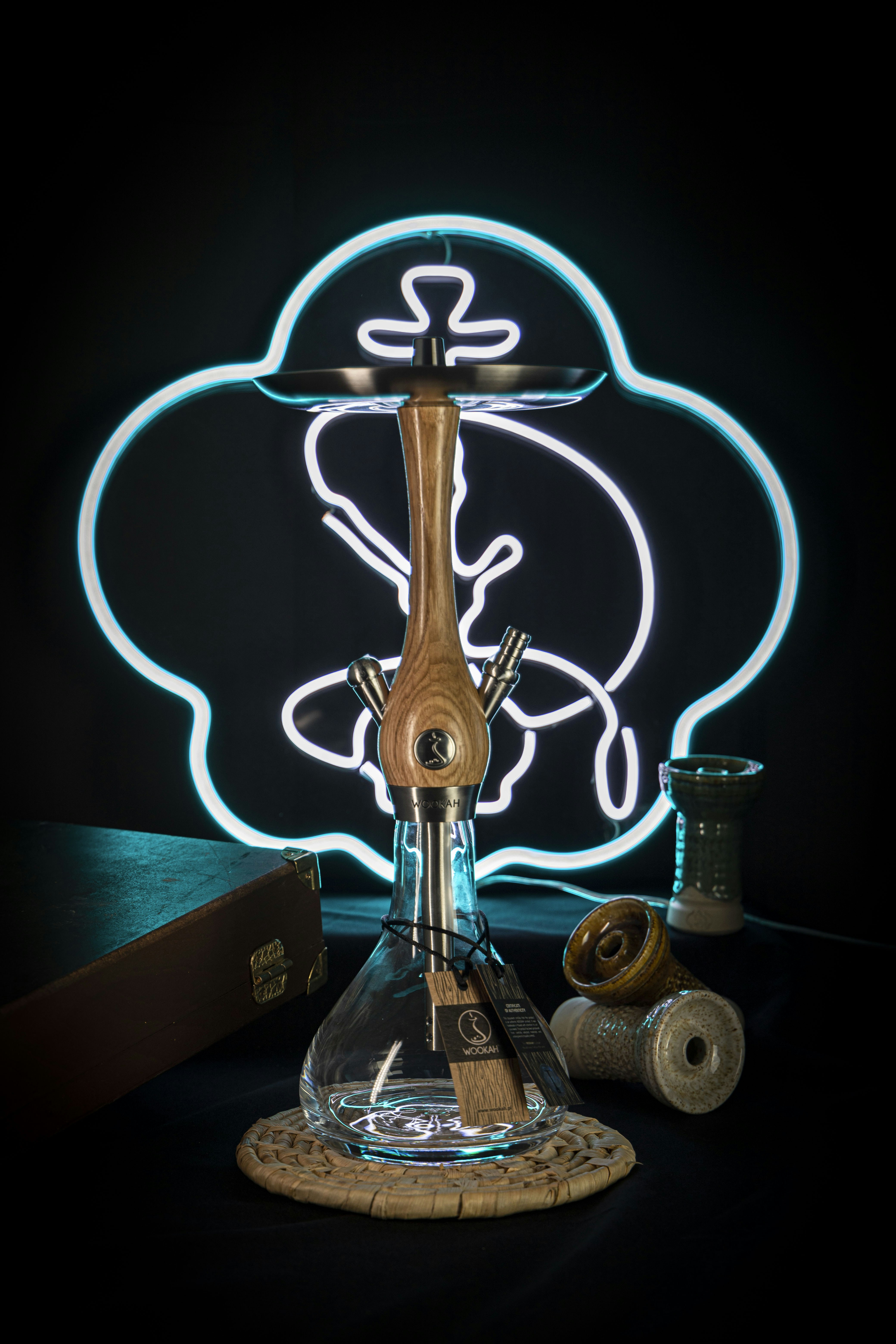 Neon Bloom: A Hookah Stand Under Electric Neon