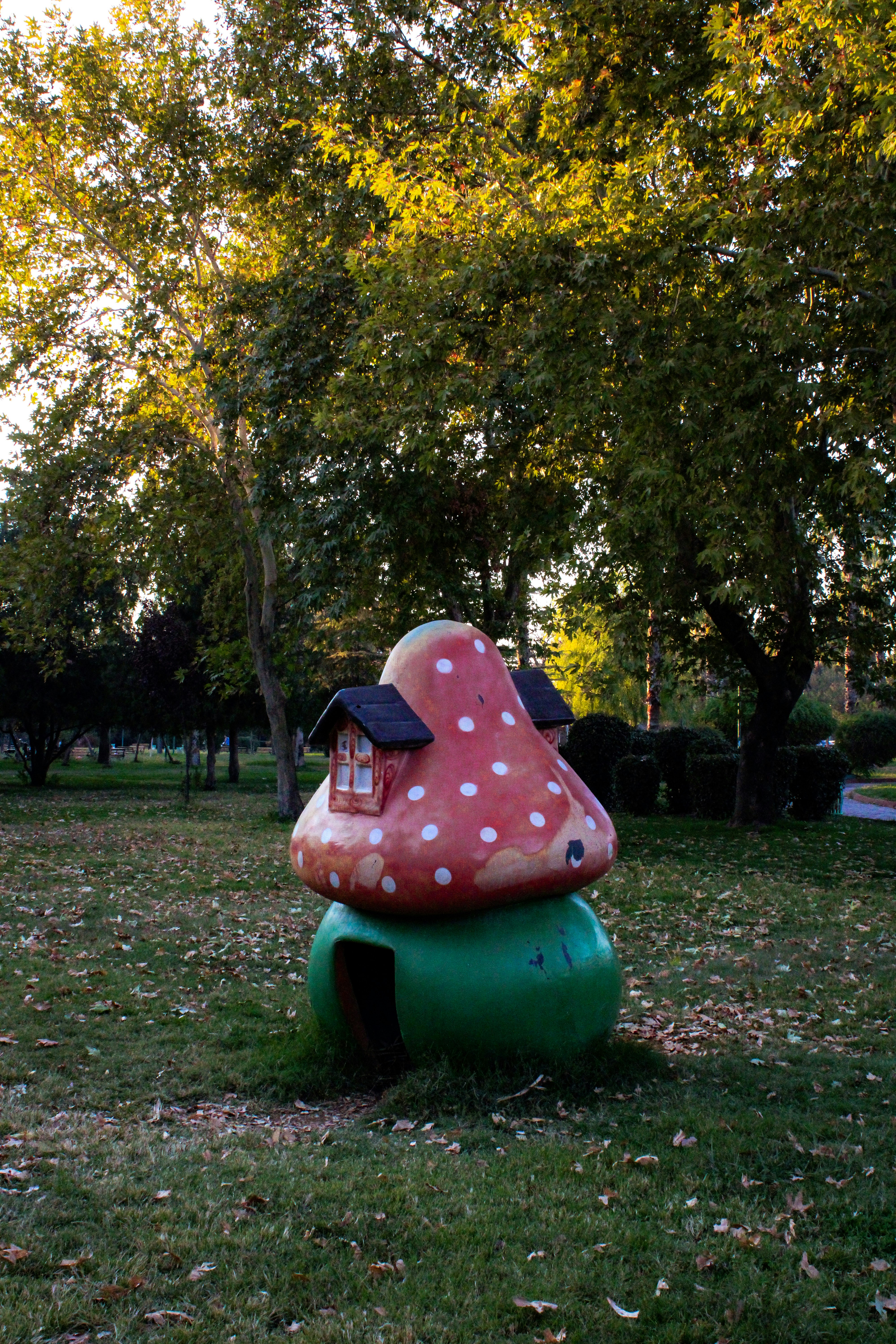 Dappled Park Mushroom House: A Playful Sculpture in Autumn Light