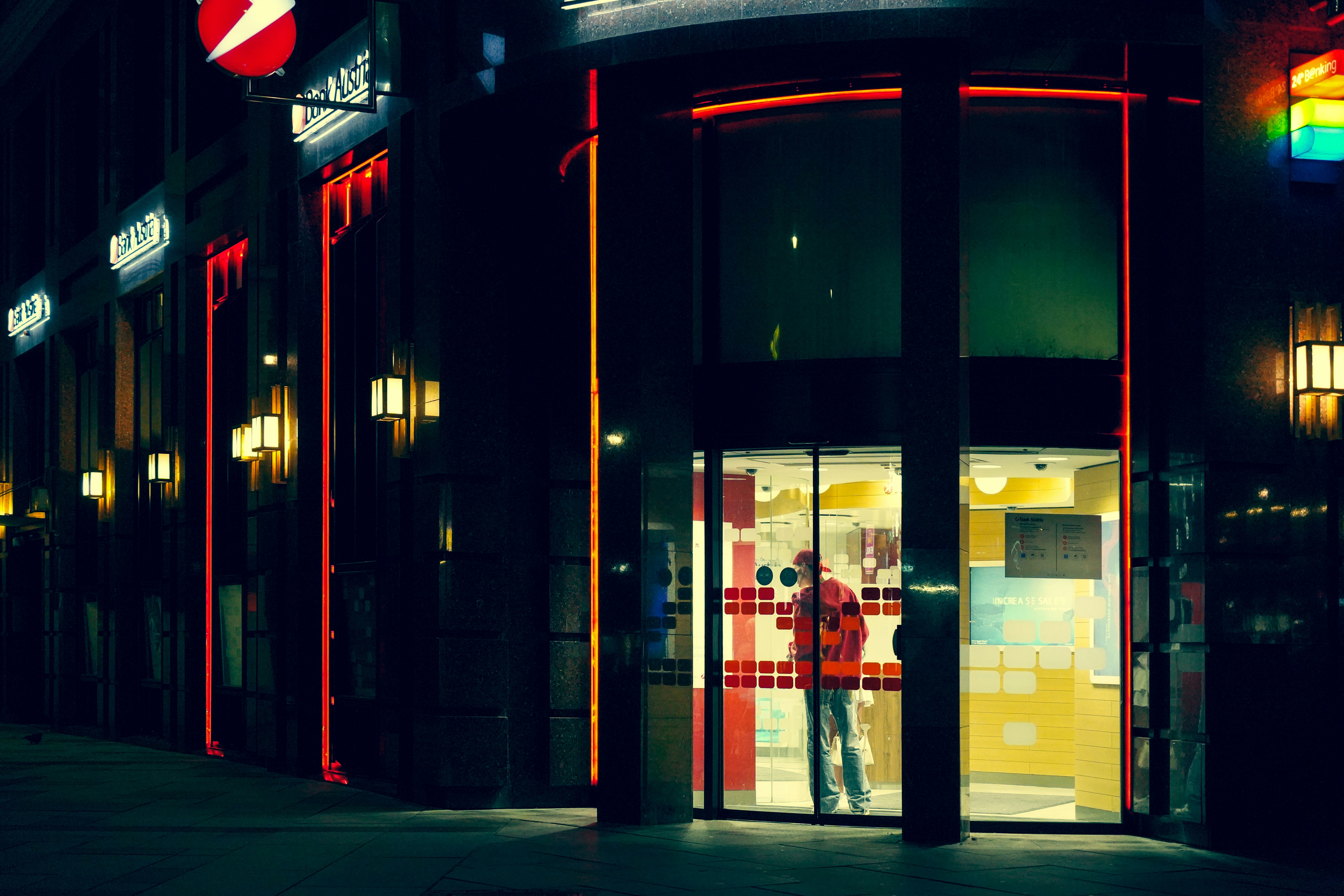 A person walking out of a building photo – Free Street photography ...